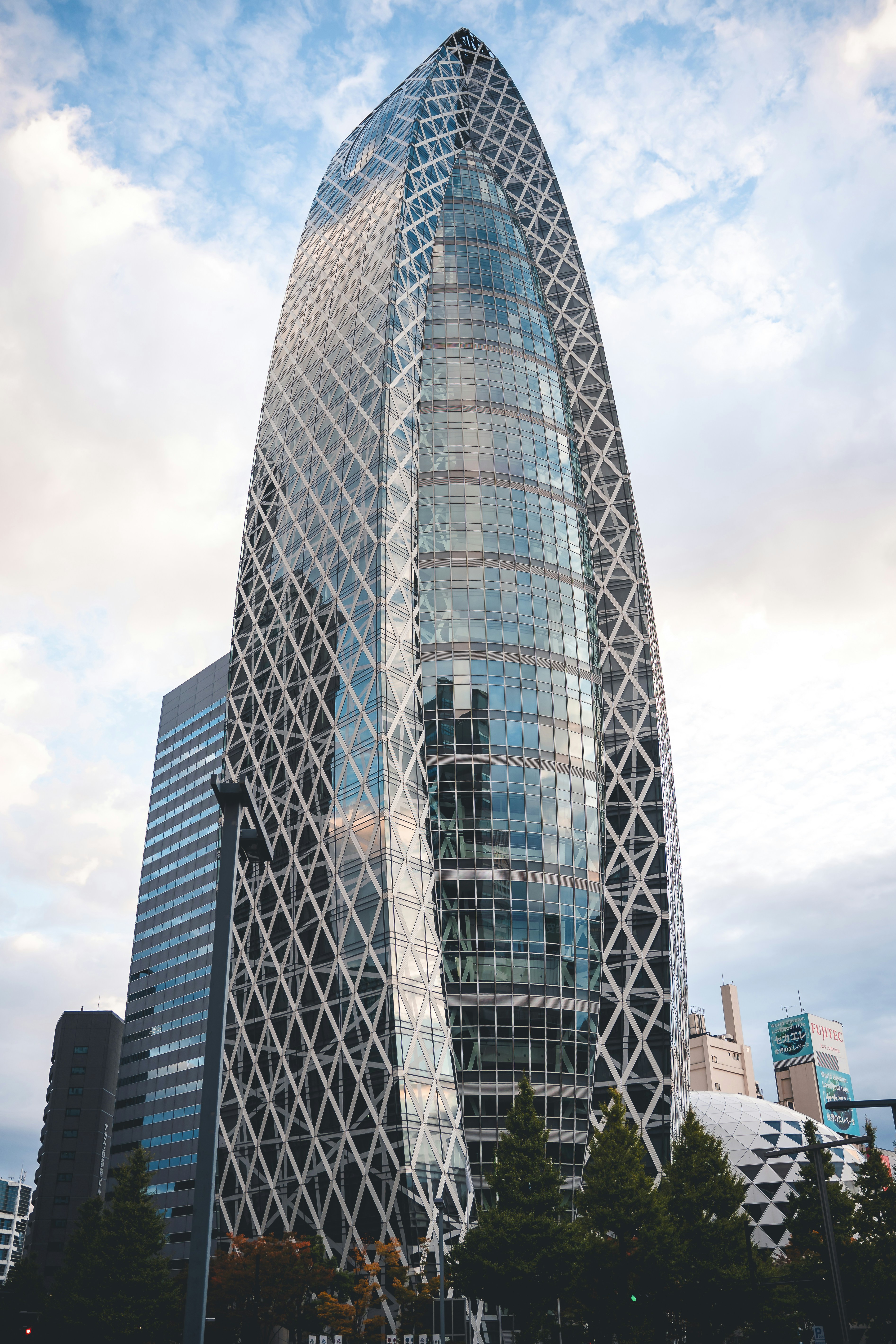 A very tall glass building with a sky background photo – Free Japan ...