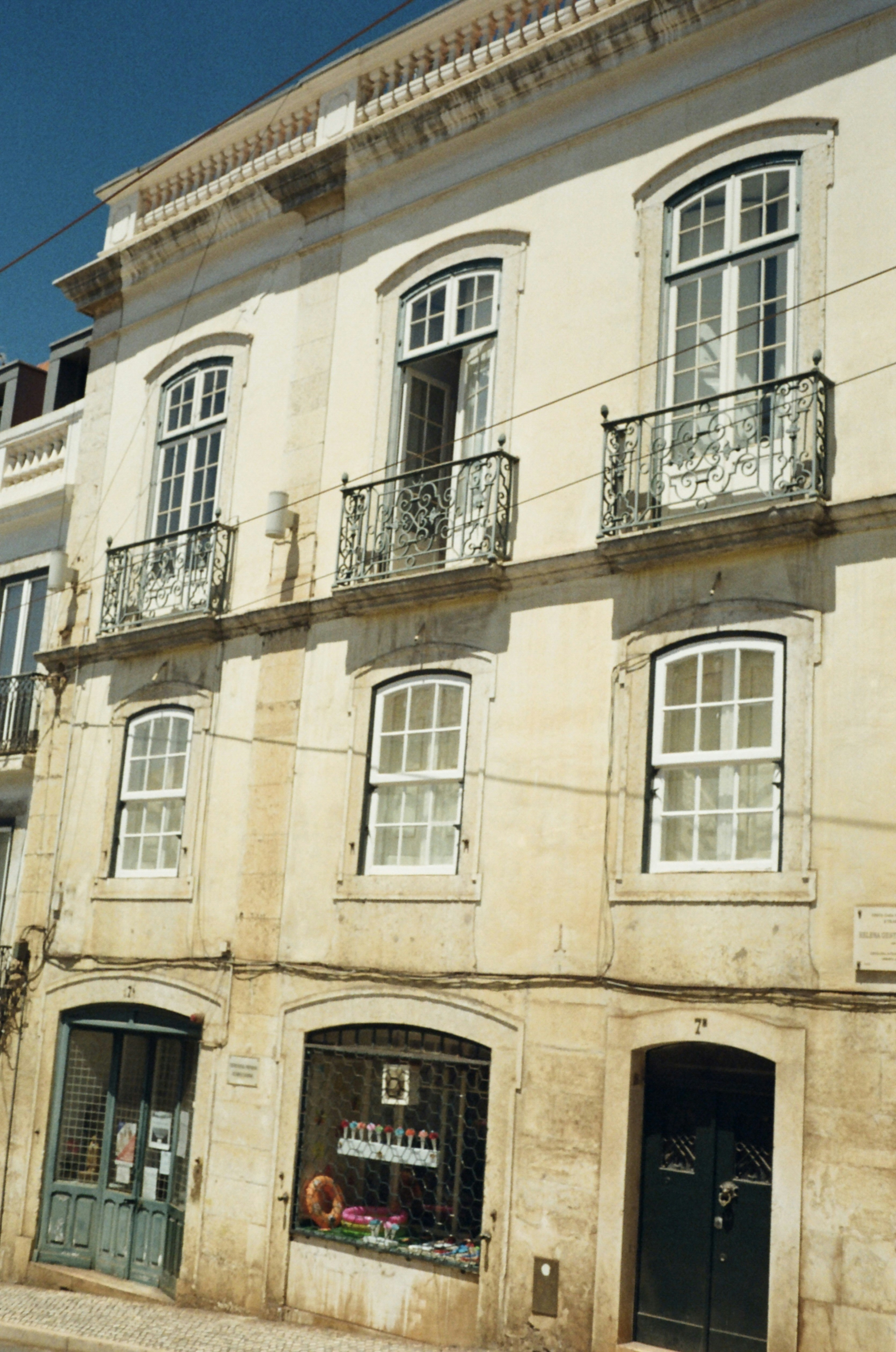 An old building with a clock on the front of it photo – Free Building ...