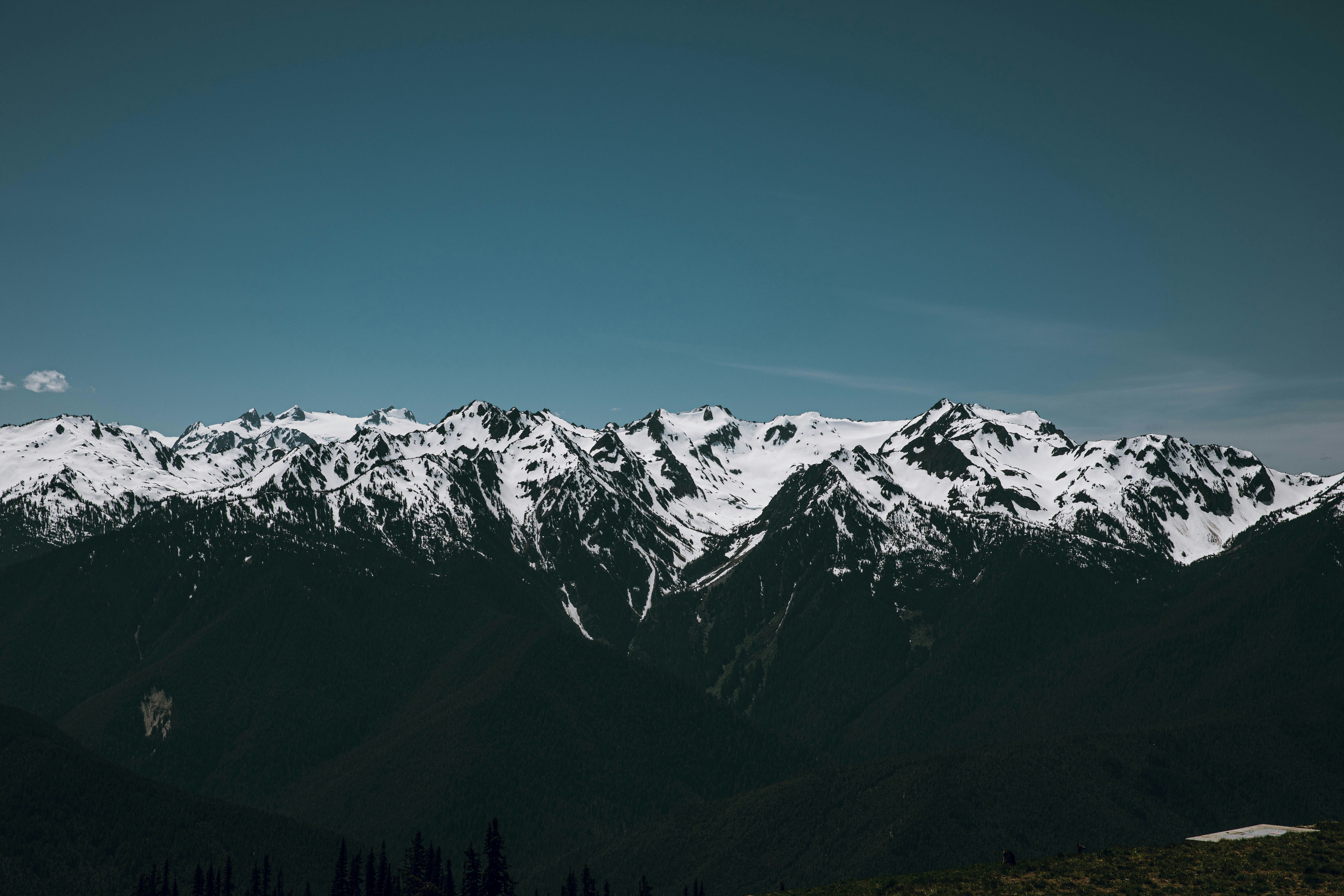 A view of a mountain range with snow on it photo – Free Mountain range ...