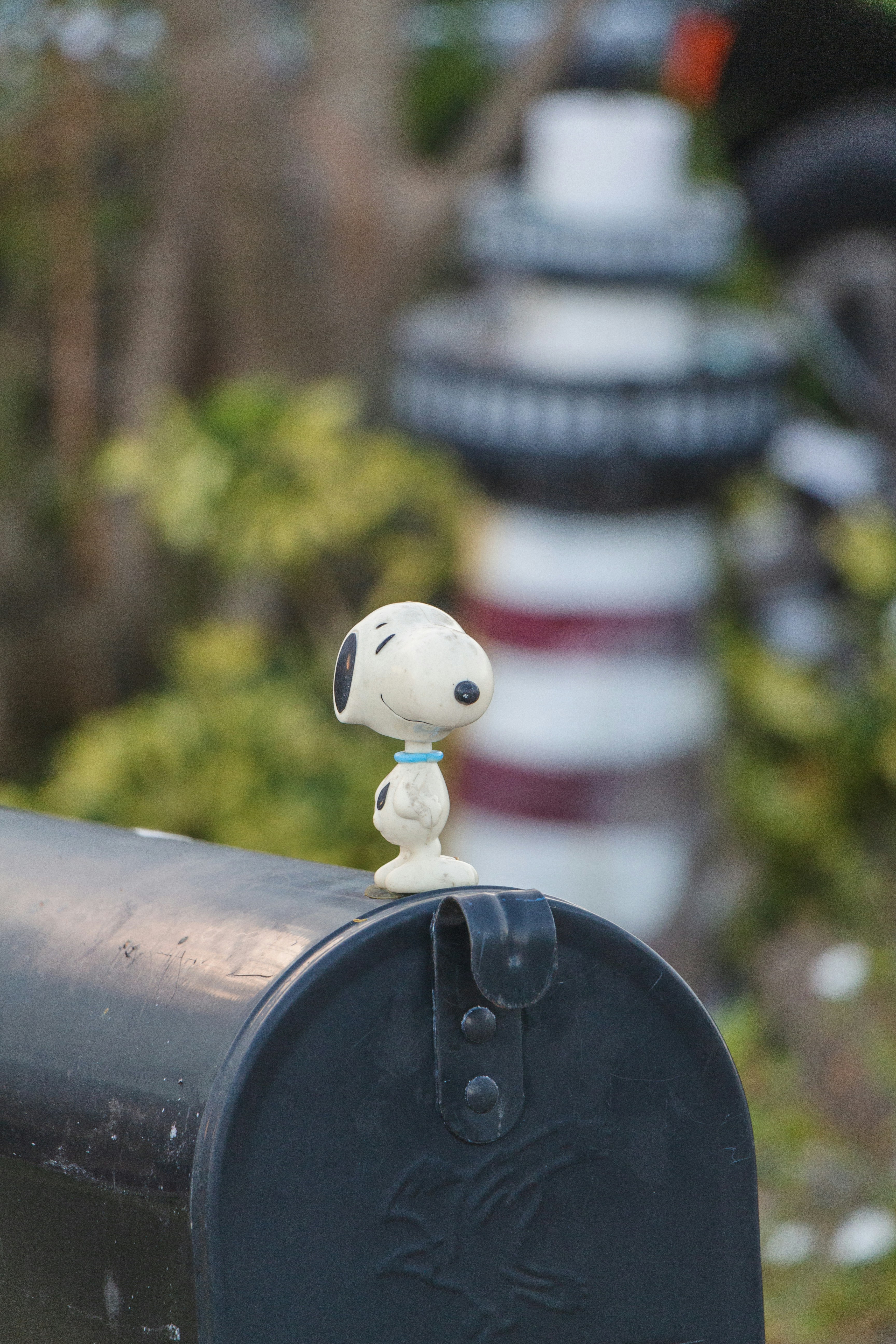 Tiny Snoopy Scout Guards the Mailbox at Garden Edge