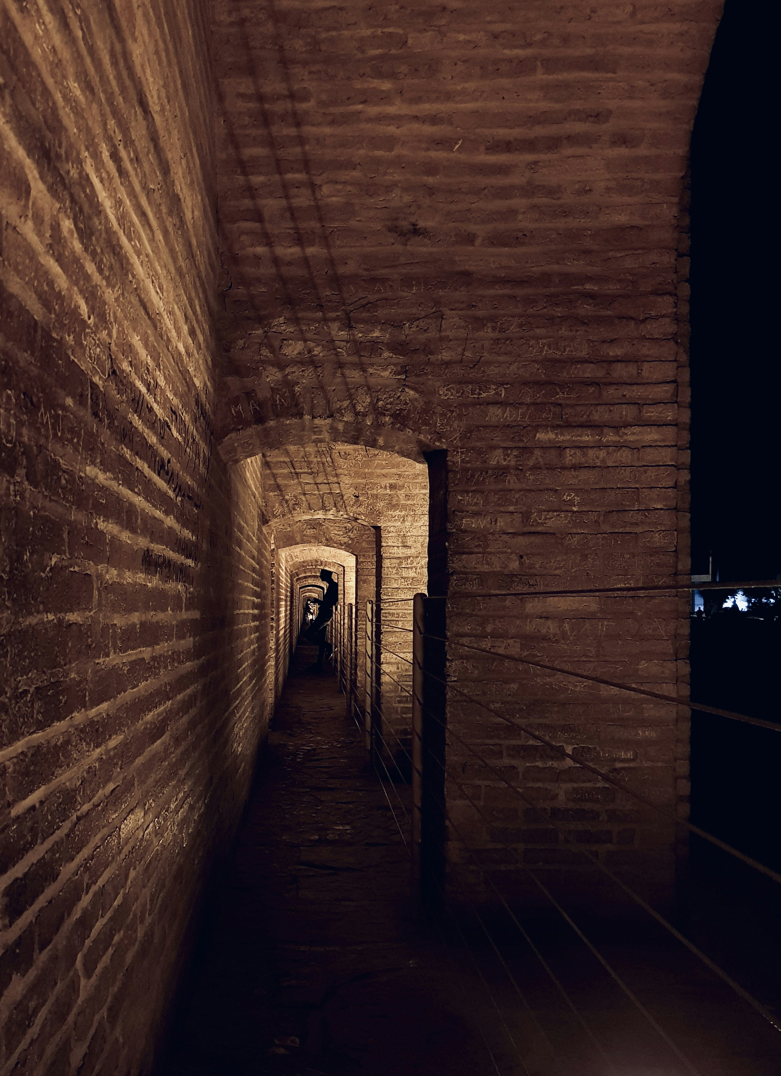 Oculus of the Brick Corridor: A Night Walk Through Arched Echoes