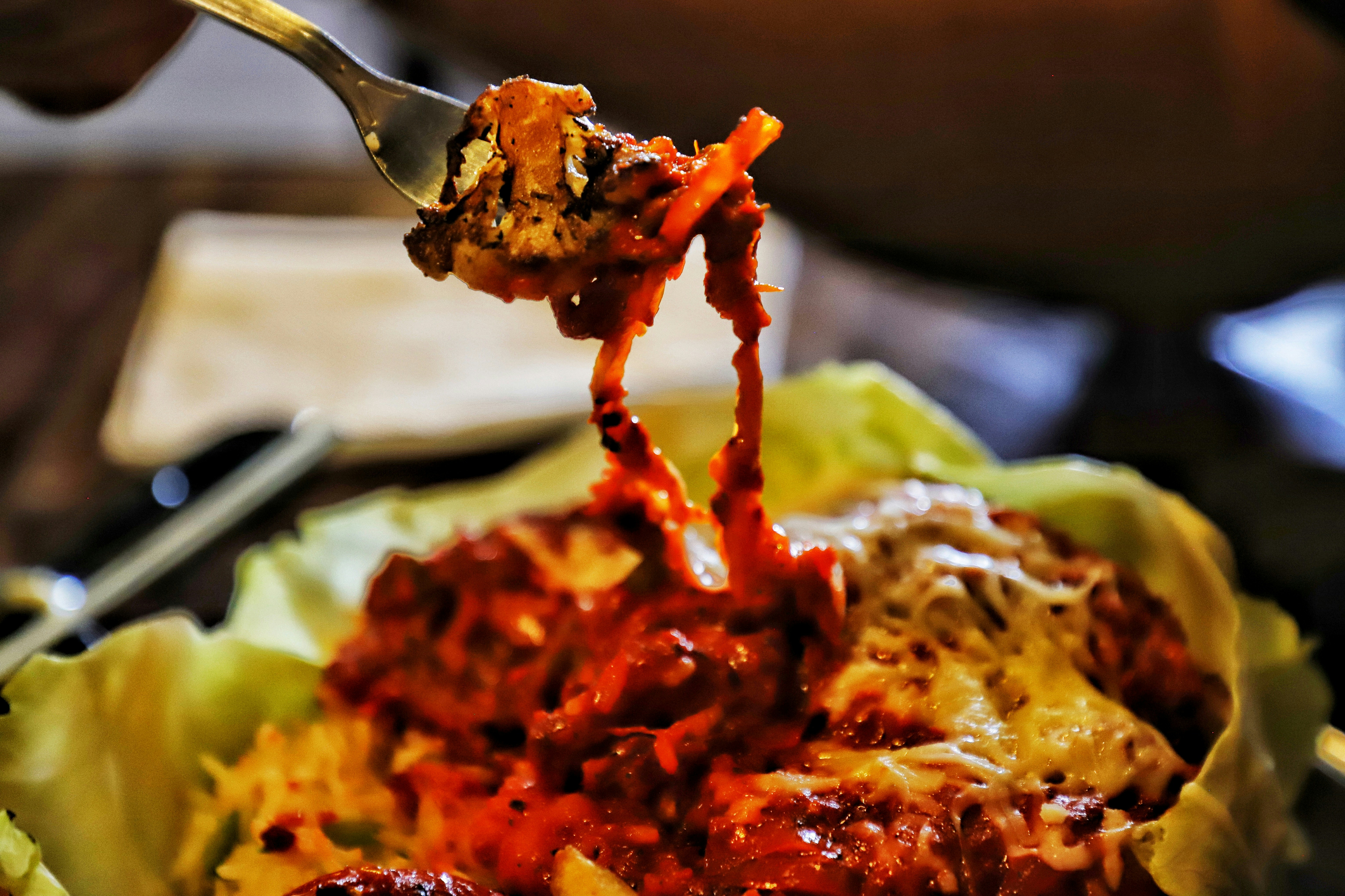 A person holding a fork full of food photo – Free Jodhpur Image on Unsplash