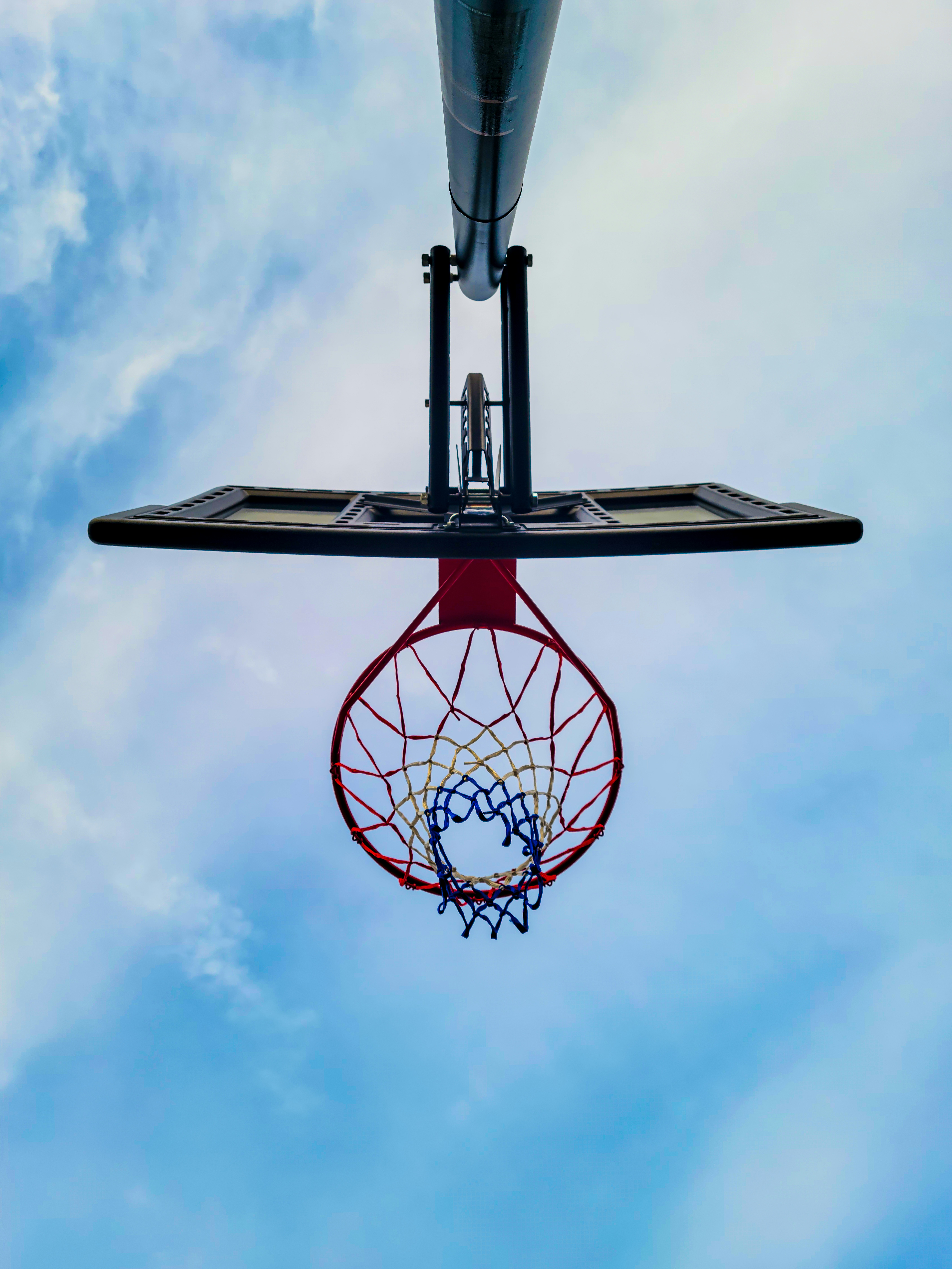 A basketball hoop with a basketball inside of it photo – Free ...