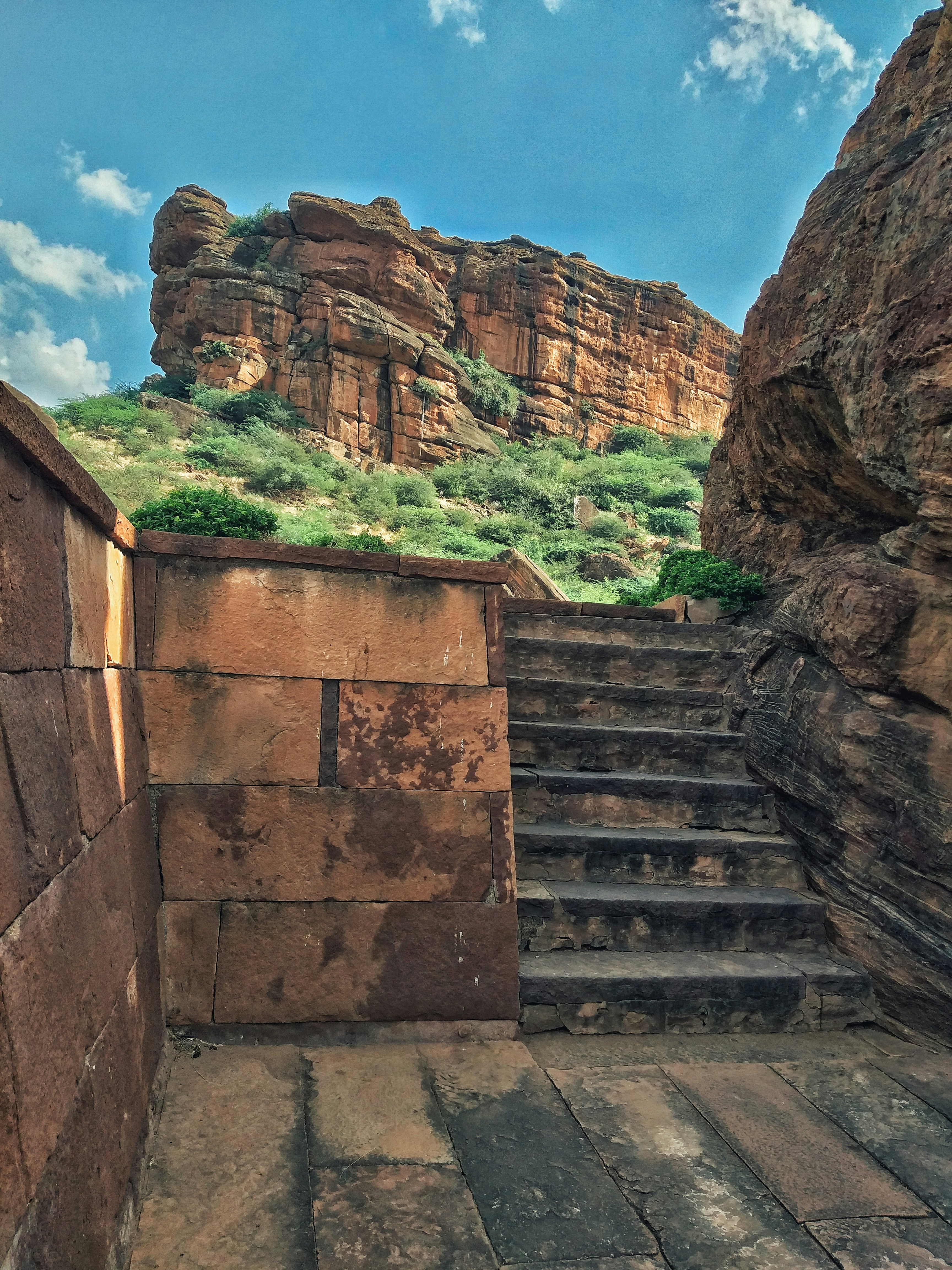 A set of stairs leading up to a cliff photo – Free Badami Image on Unsplash
