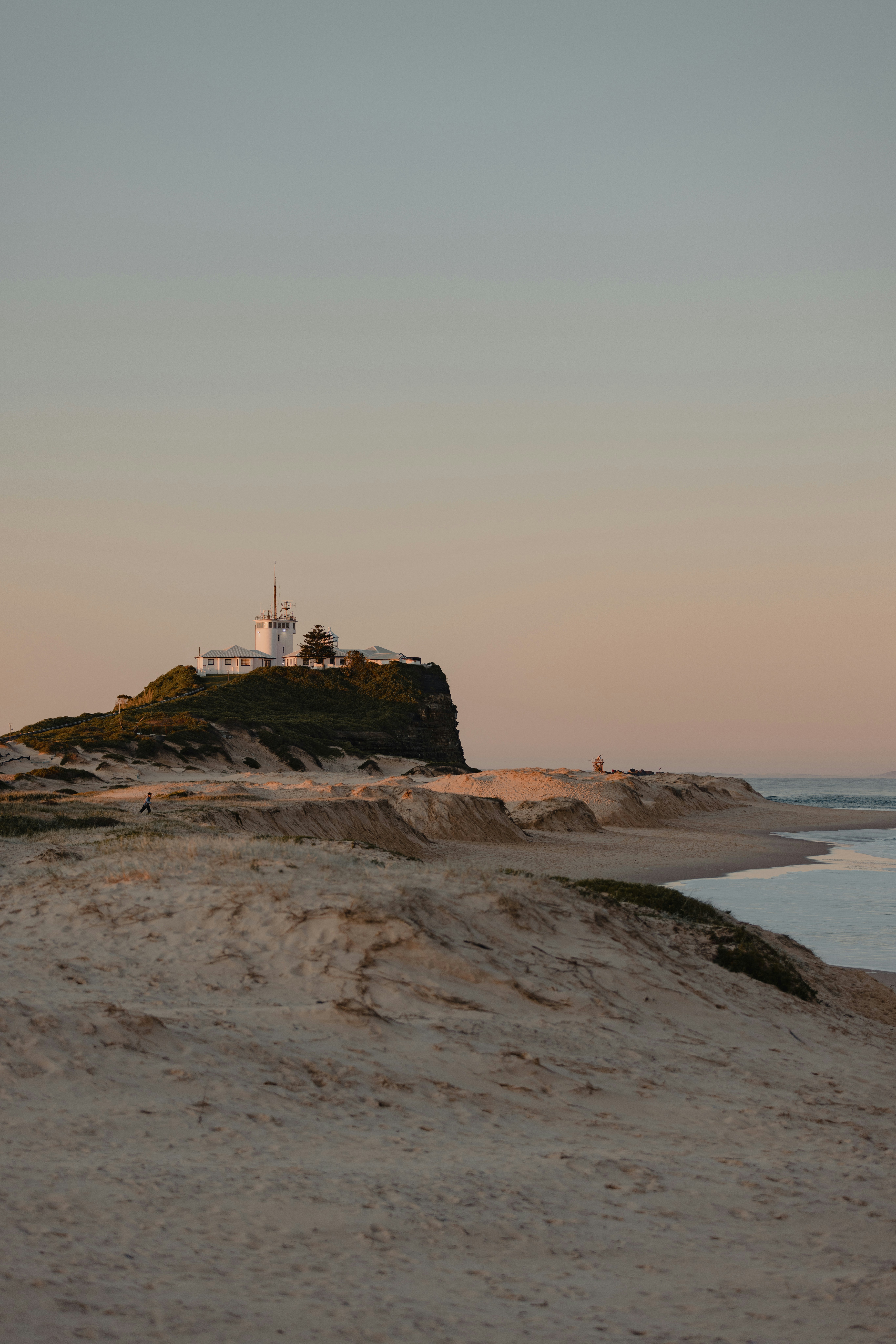 Verdant Promontory Lighthouse at Dusk