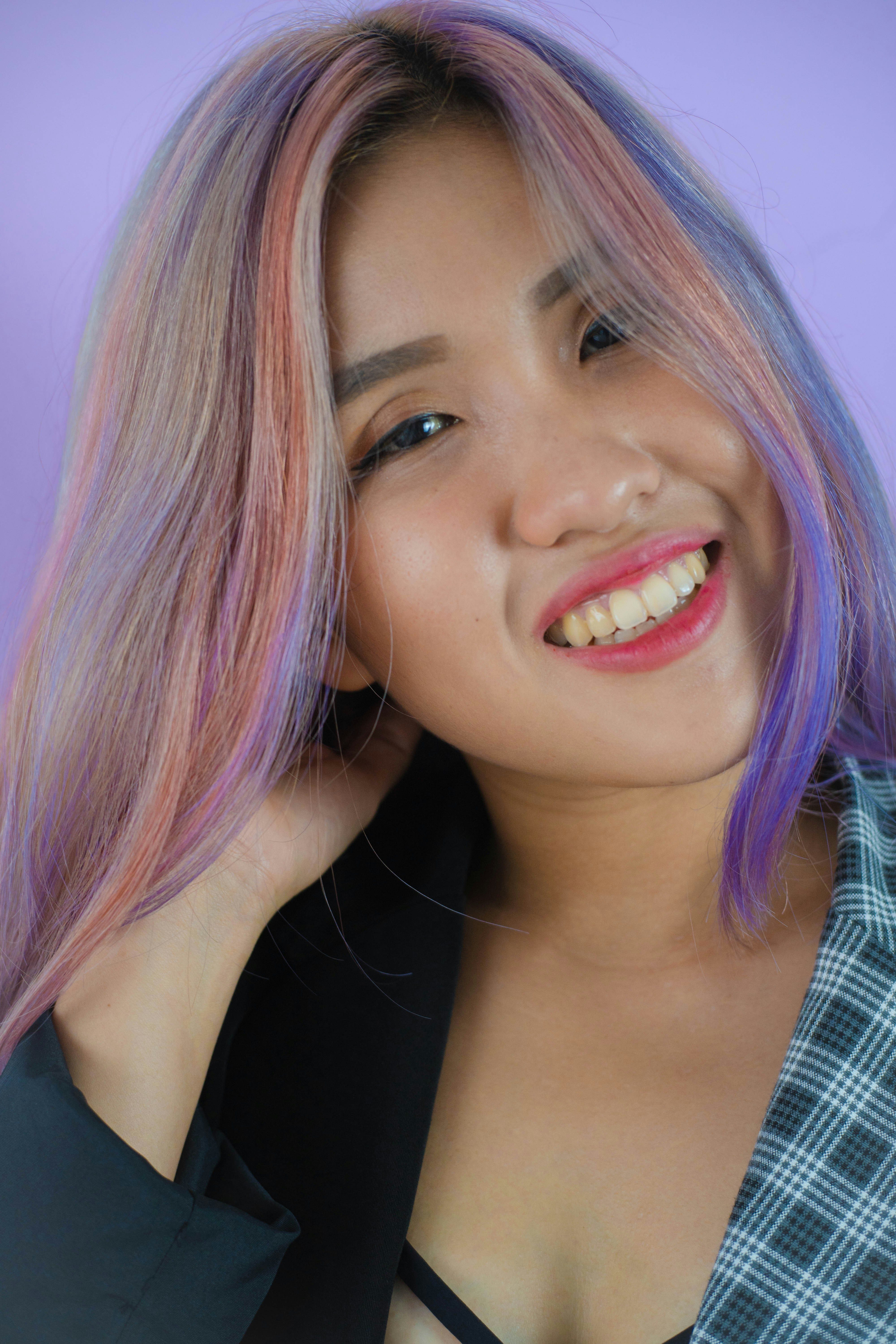 Radiant Prism: Colorful Portrait with a Playful Smile