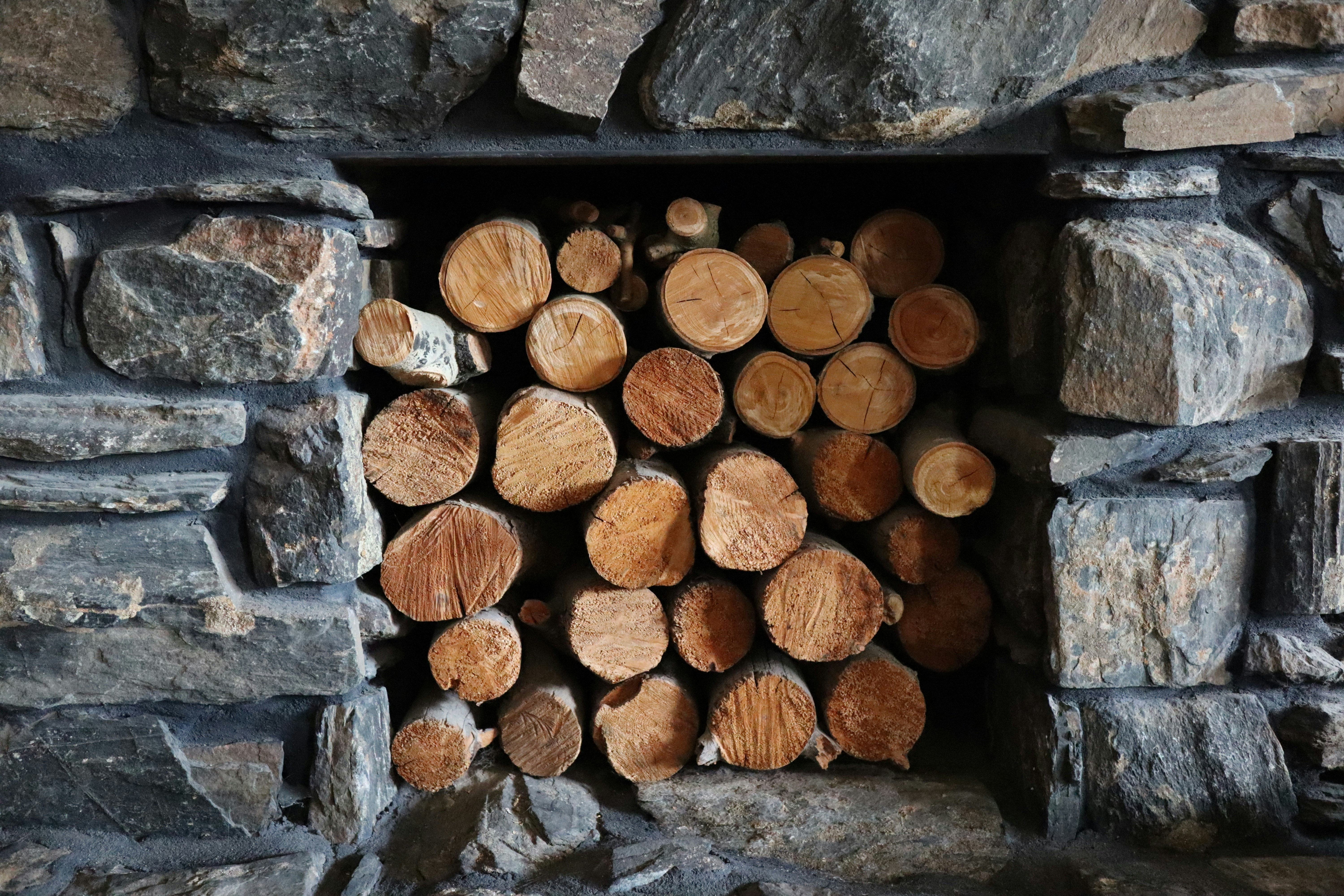 Hearth Core: Circular End-Grain Mosaic in a Rough Stone Niche