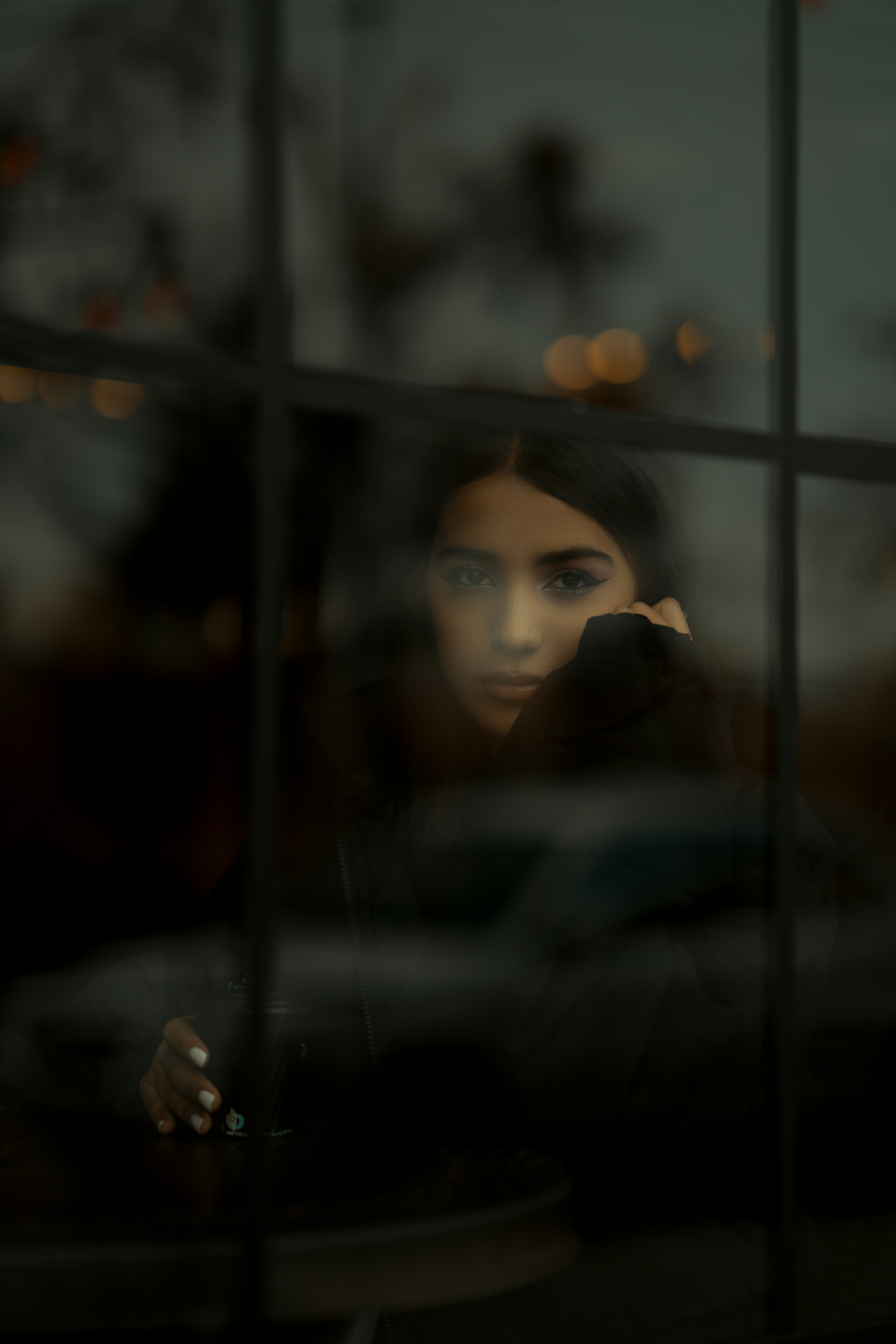 A woman looking through a window at a car photo – Free Portrait Image ...