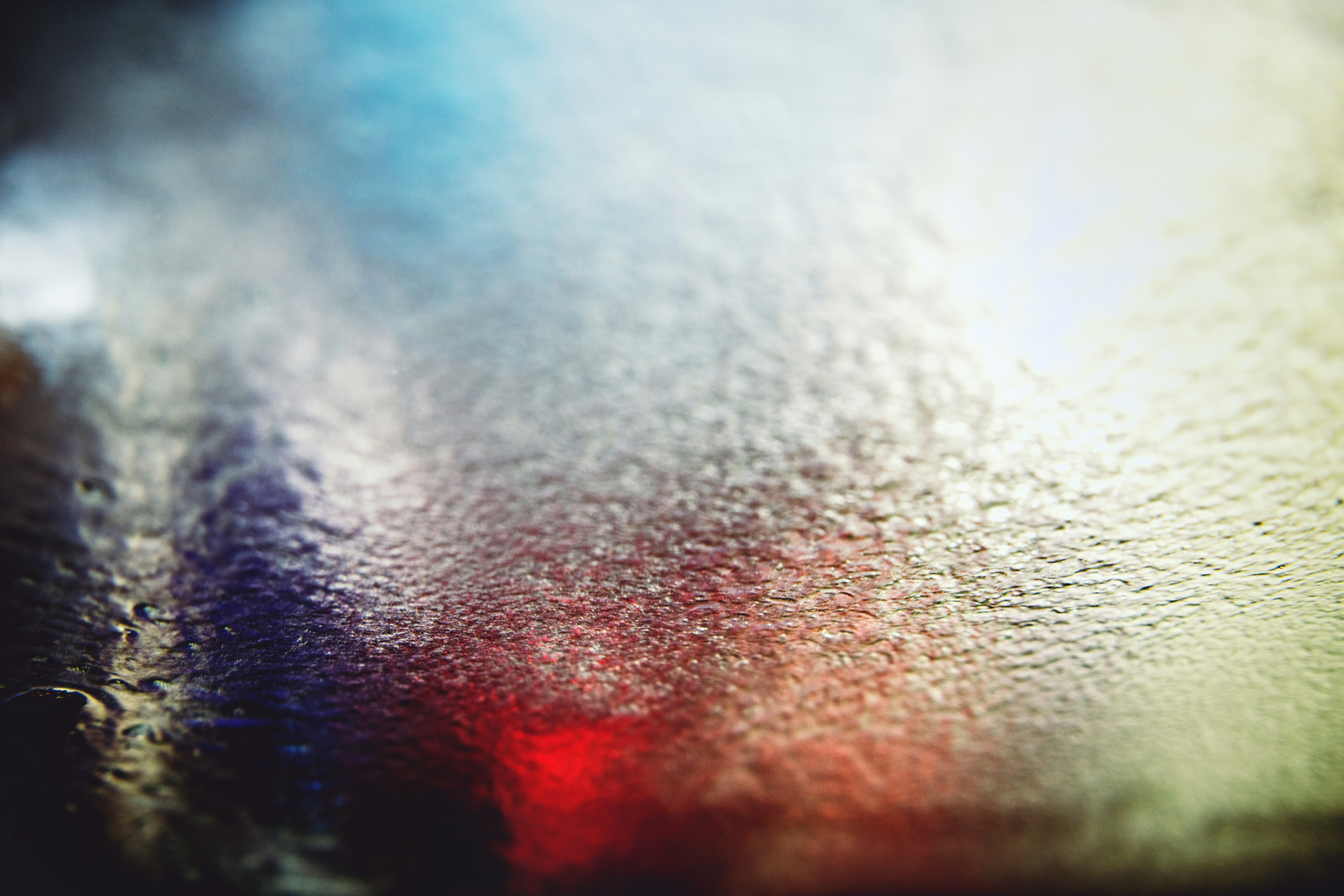 Prismatic Frost: Fragments of Color on a Frosted Glass Surface