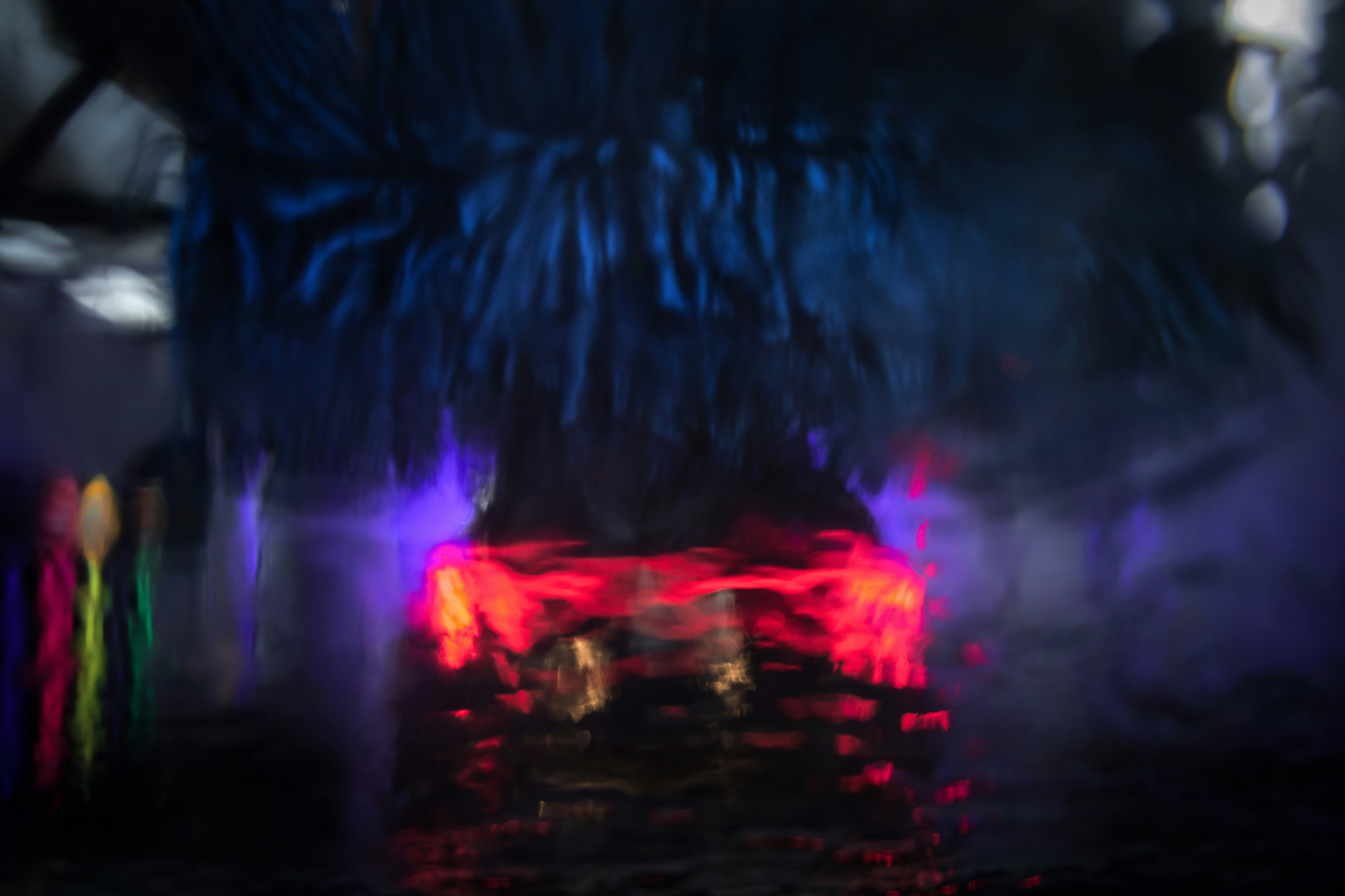 Neon Ripples: Reflections in a Night-Wlooming Fountain
