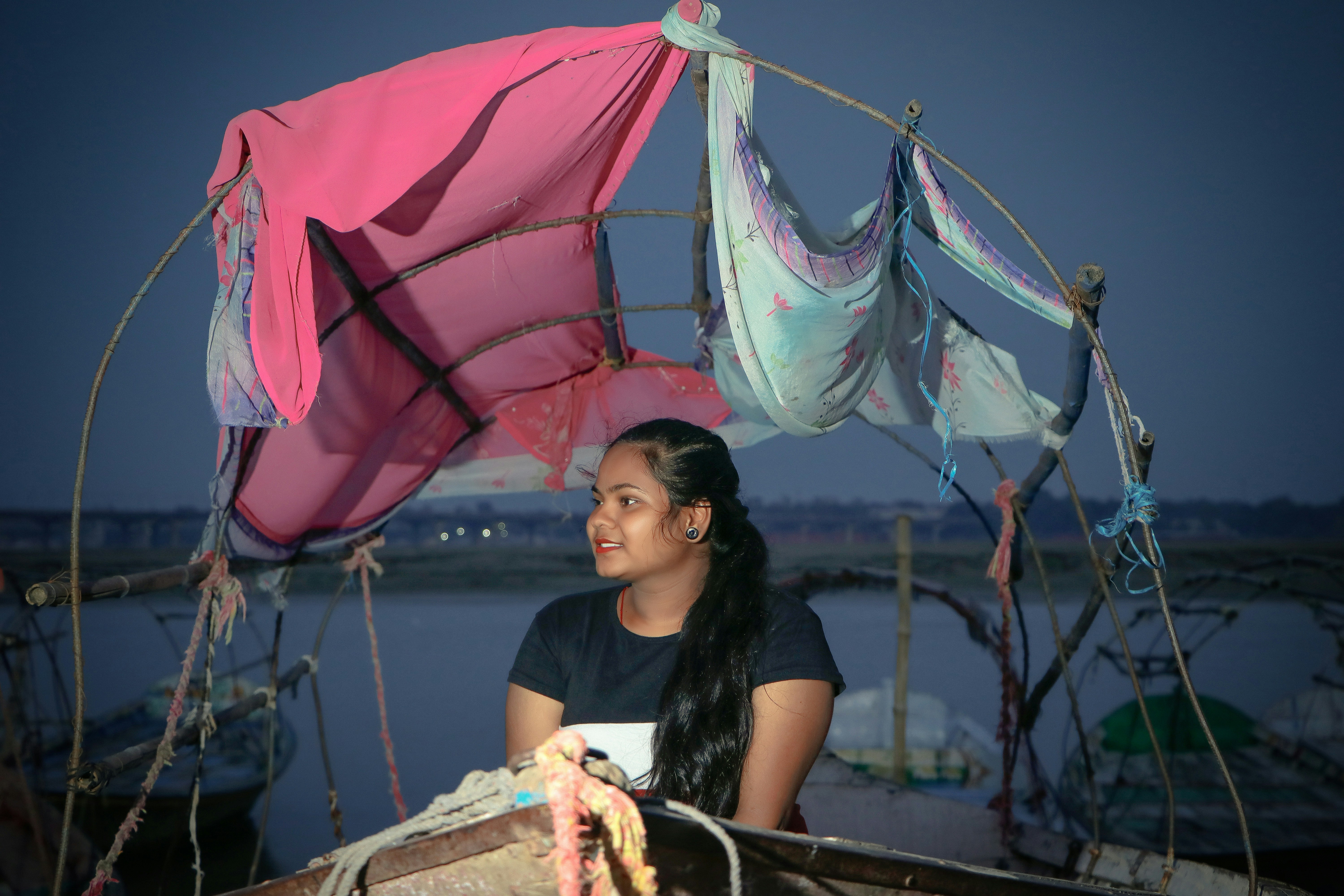 Portrait under a Tented Sky: A Fisherwoman Amid Her Tidal Stage