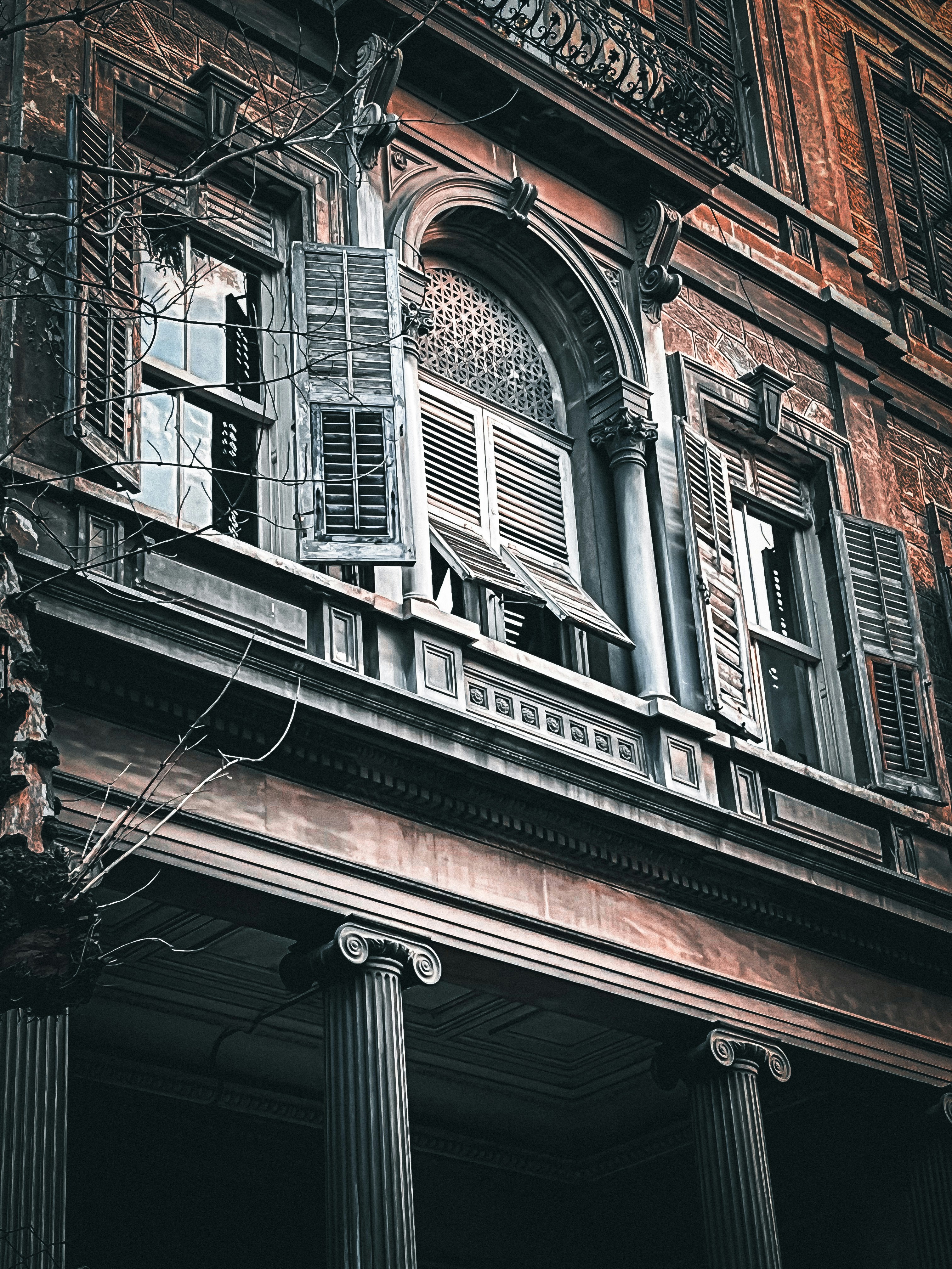 A tall building with a bunch of windows photo – Free Building Image on ...