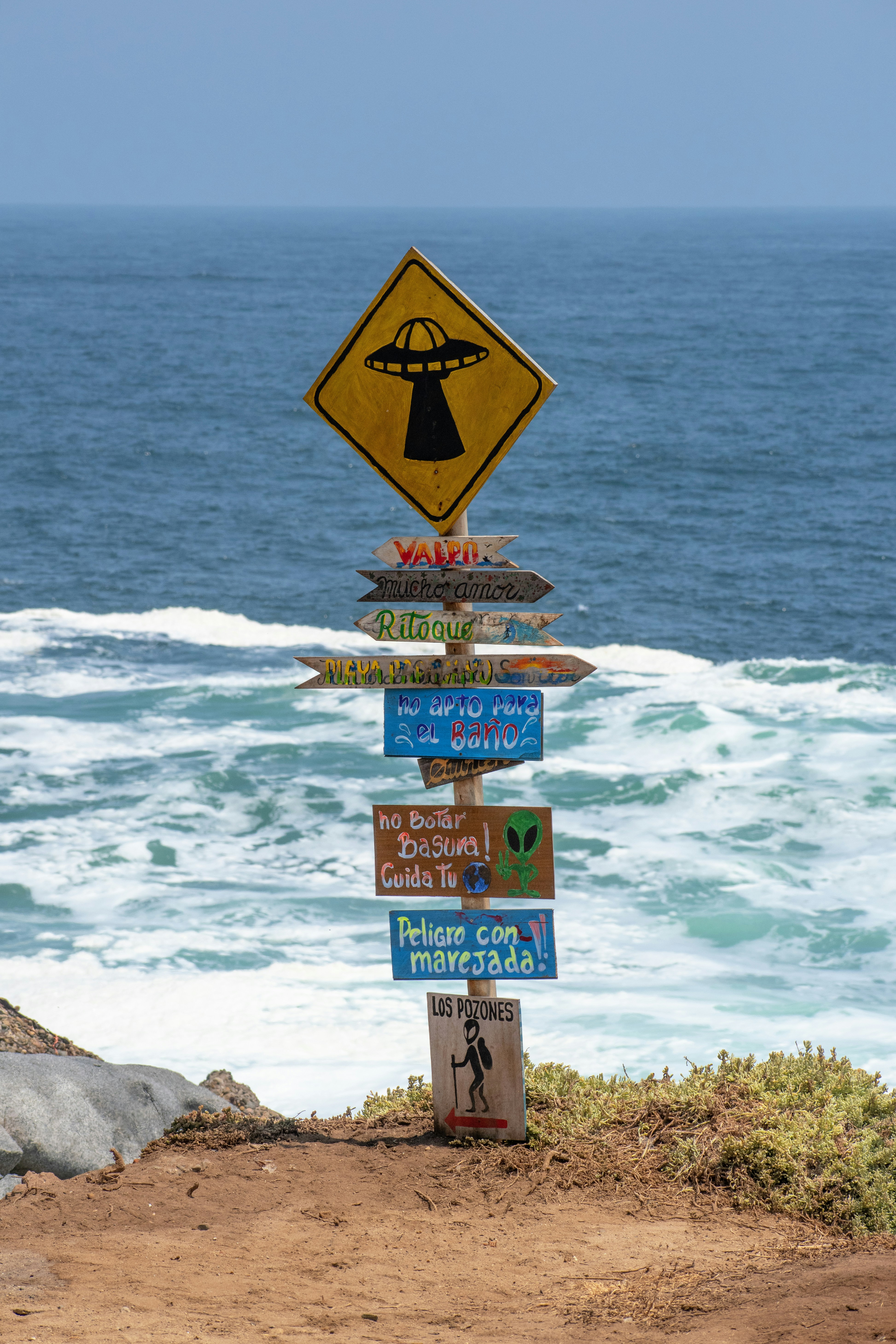 a sign that is on the side of a hill