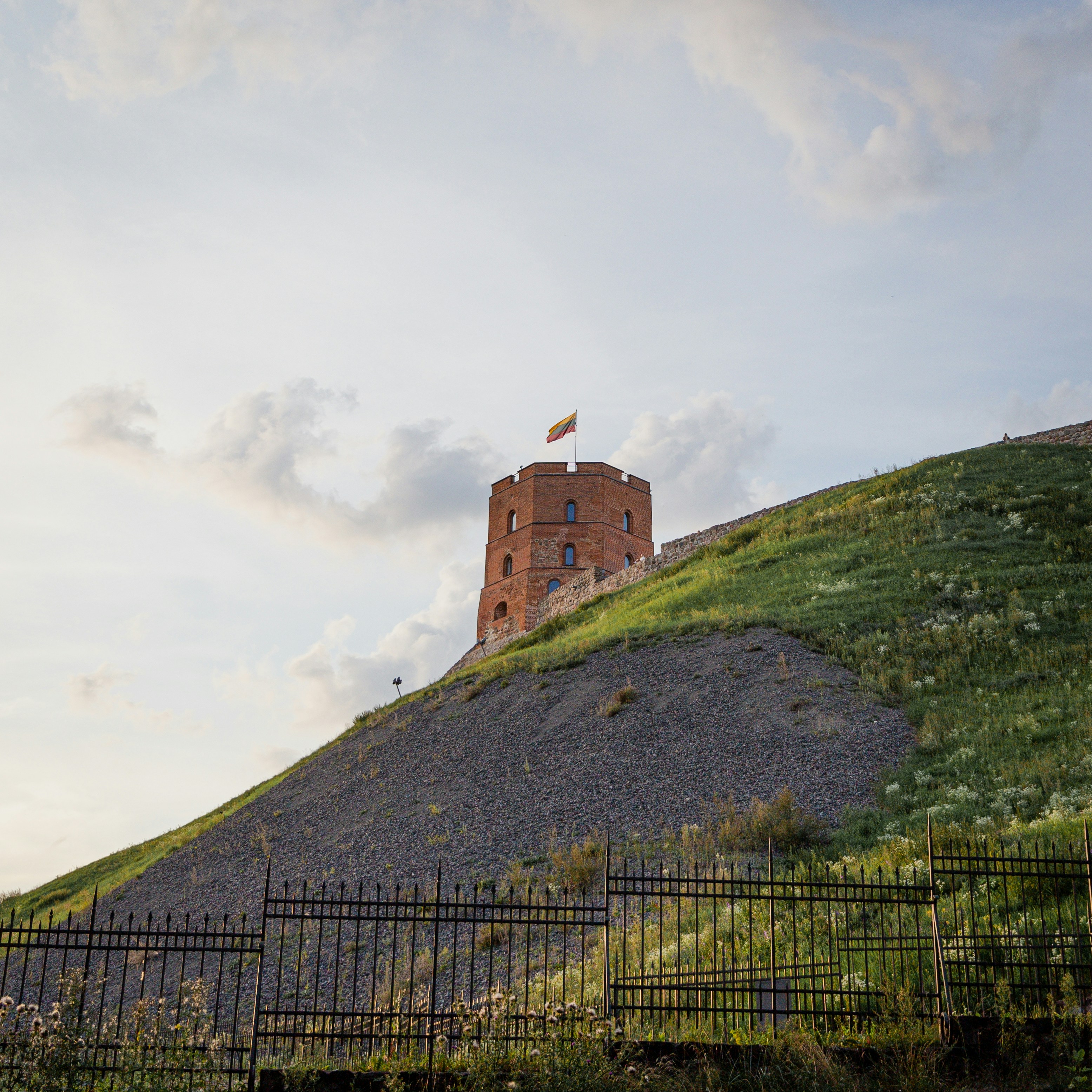 A tall brick building sitting on top of a hill photo – Free Castle ...