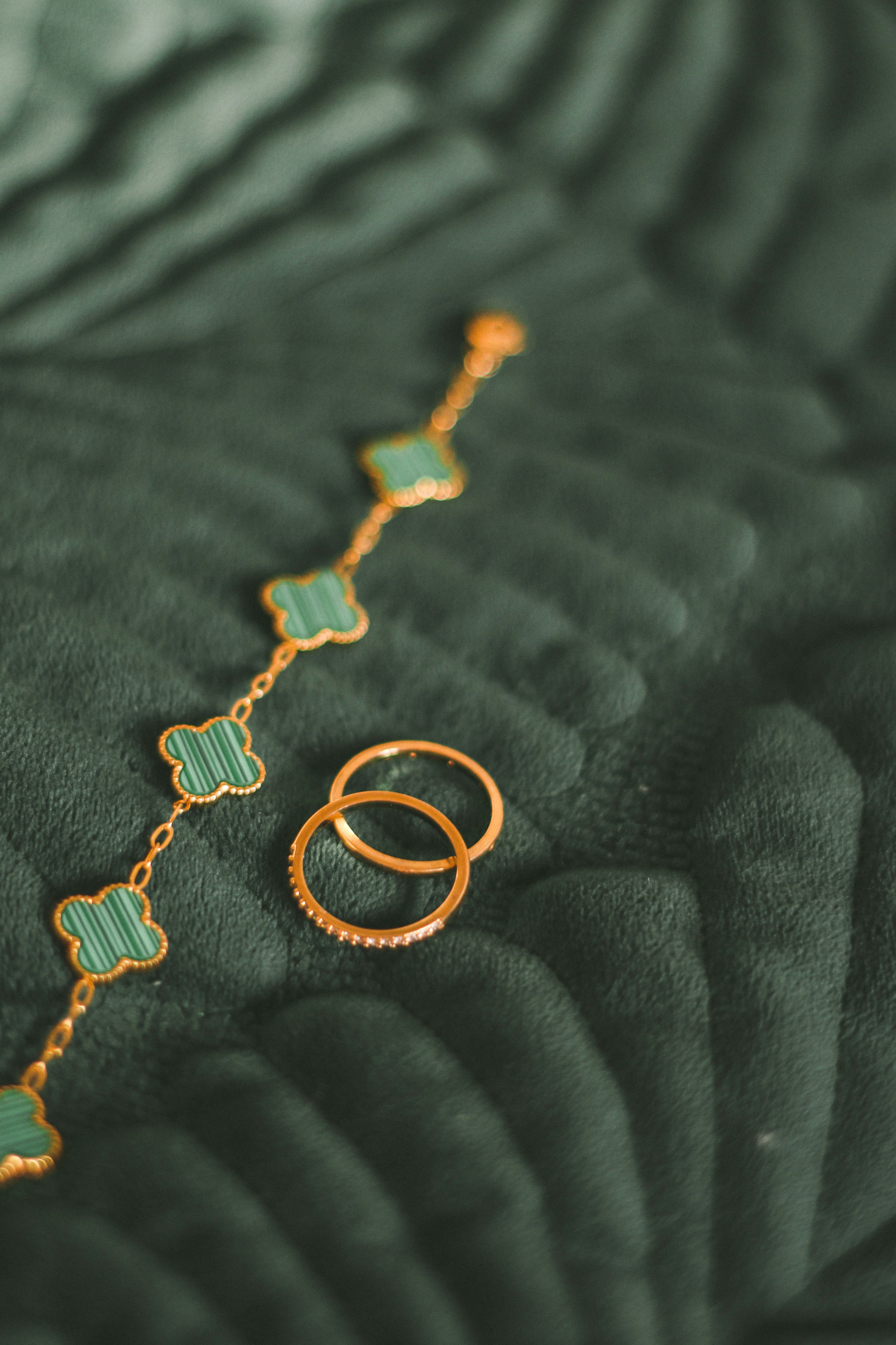a close up of a gold chain with rings on it