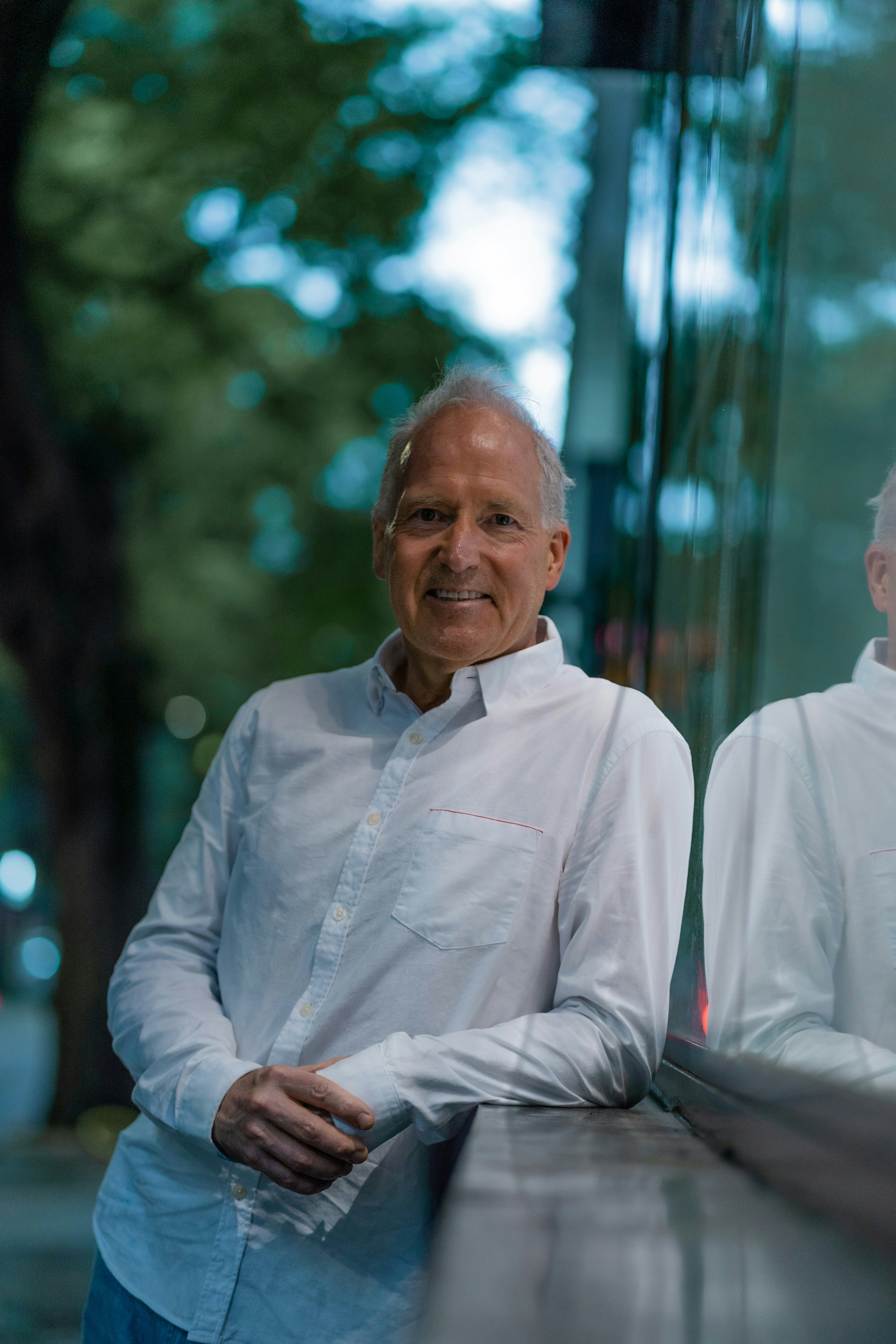 Reflections in the Glass: Portrait of stillness by the city edge