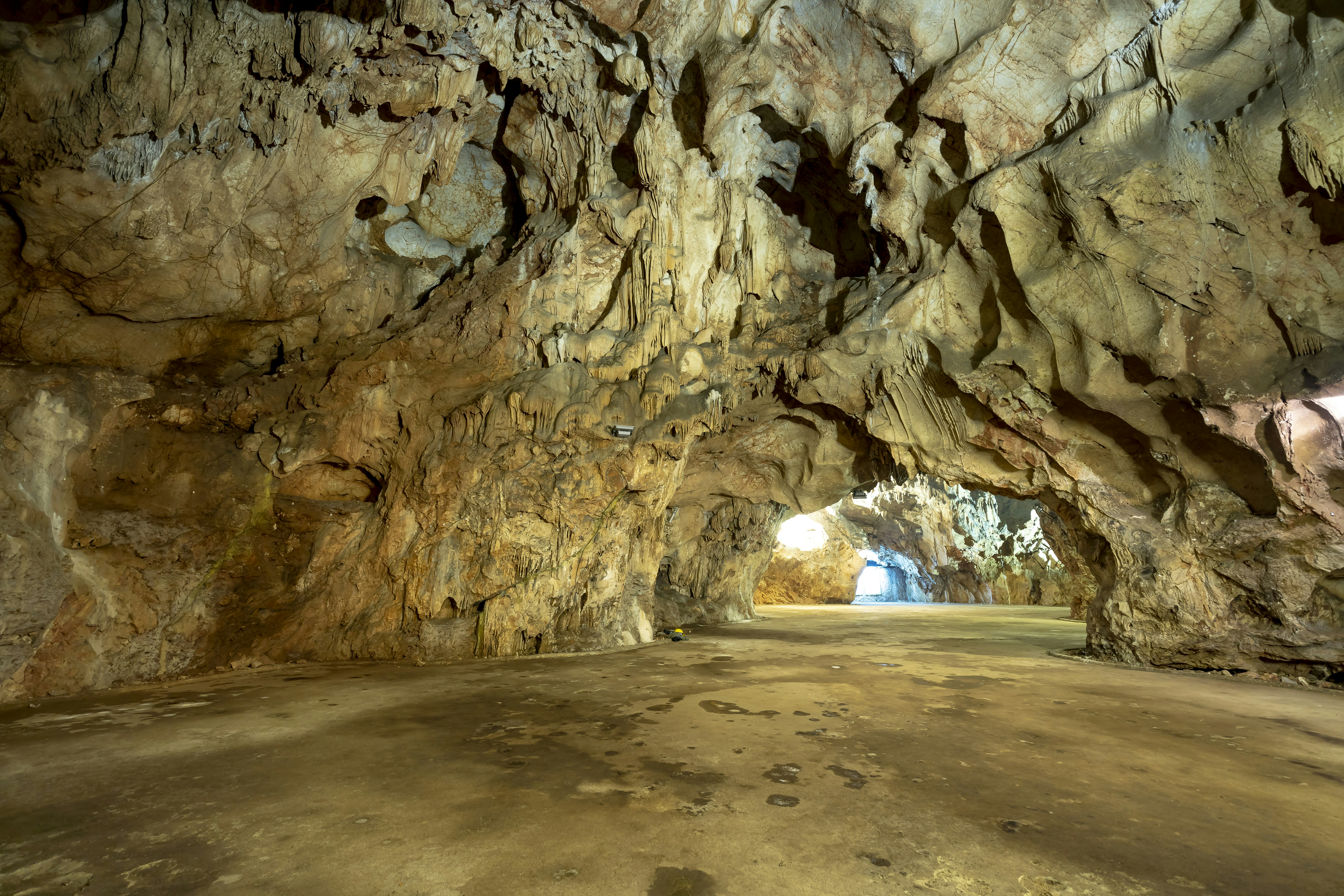 A cave filled with lots of rocks and dirt photo – Free Cave Image on ...