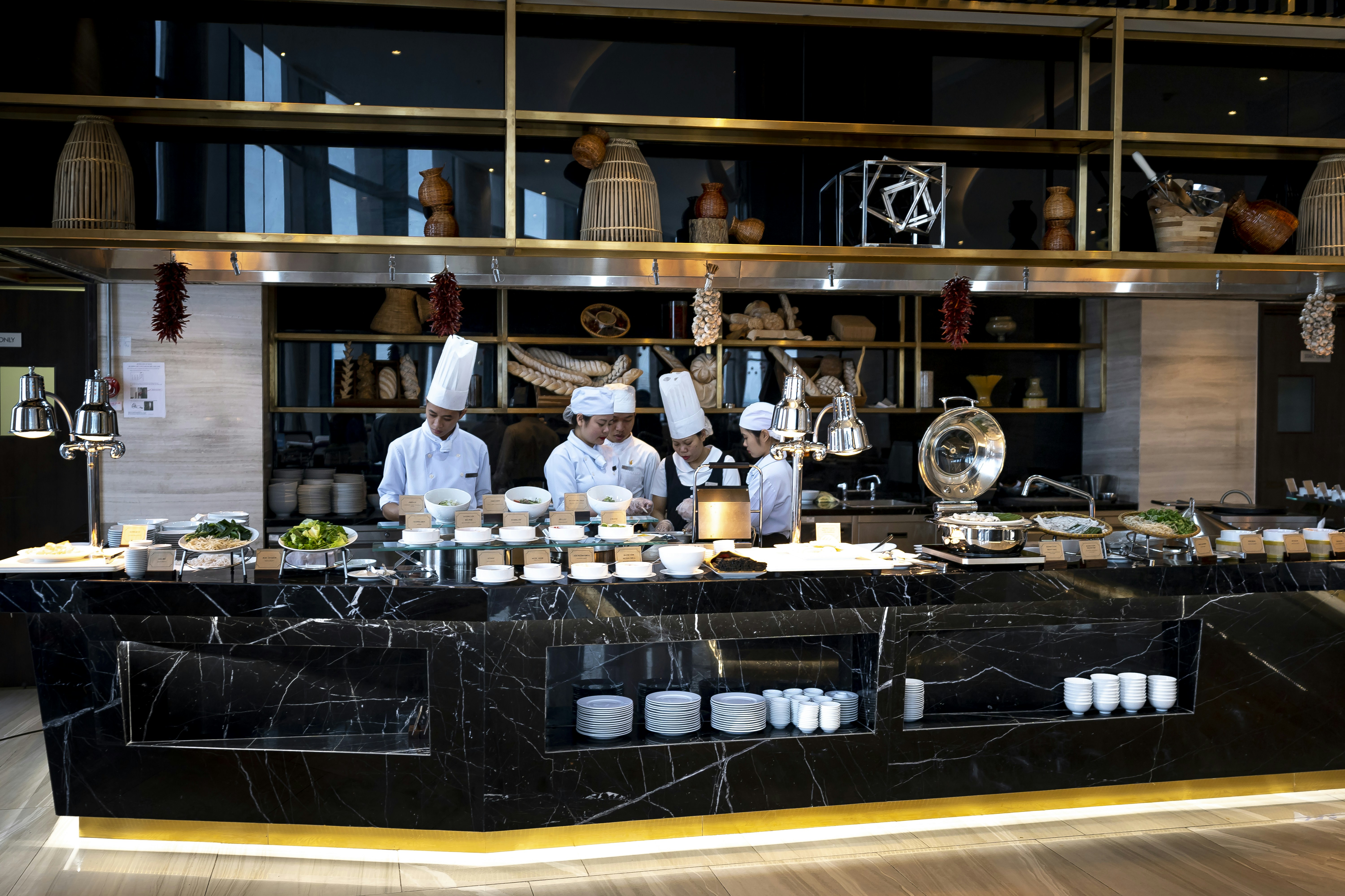 Open-Kitchen Theater: Chefs Crafting on a Marble Stage