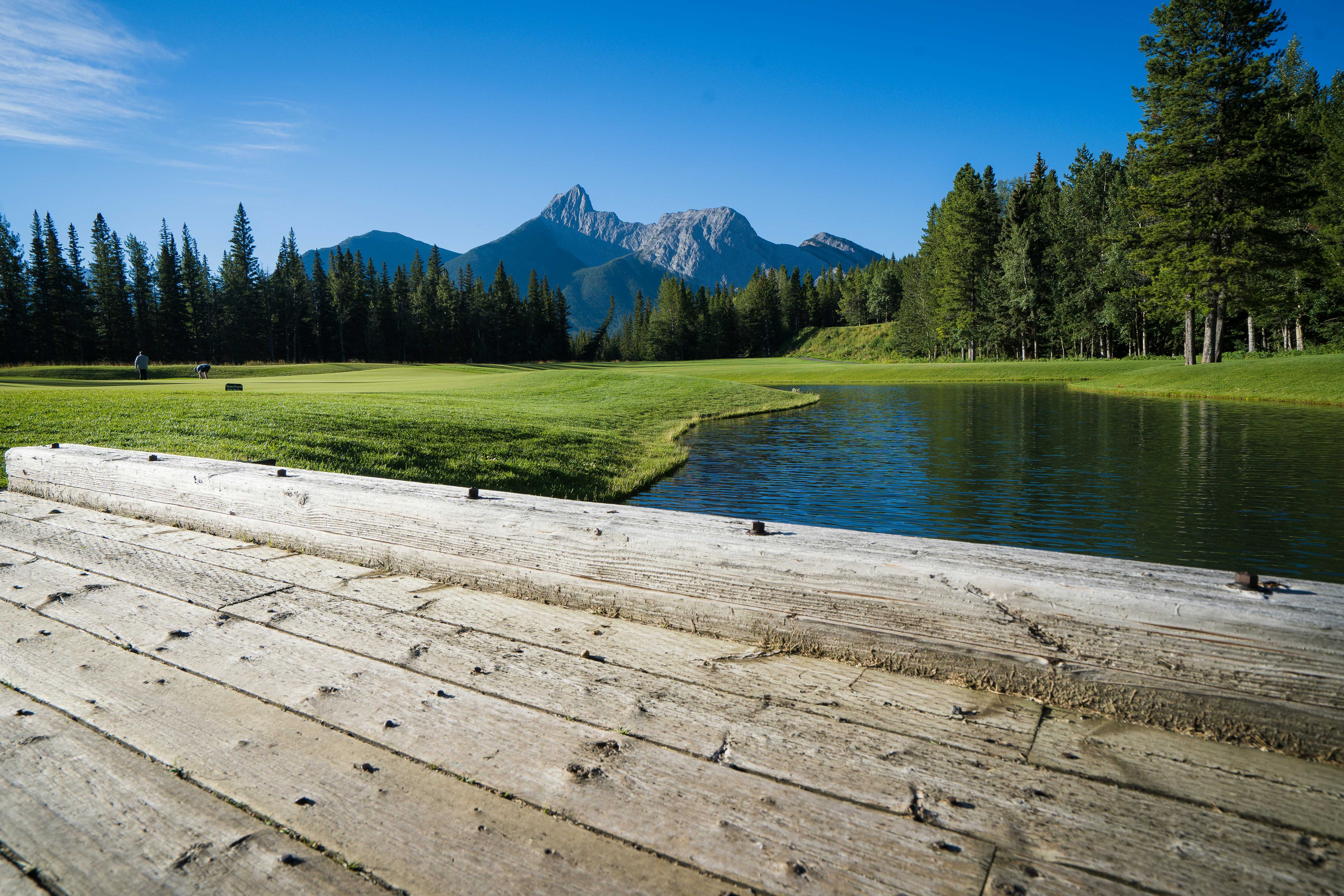A view of a lake and mountains from a wooden dock photo – Free ...