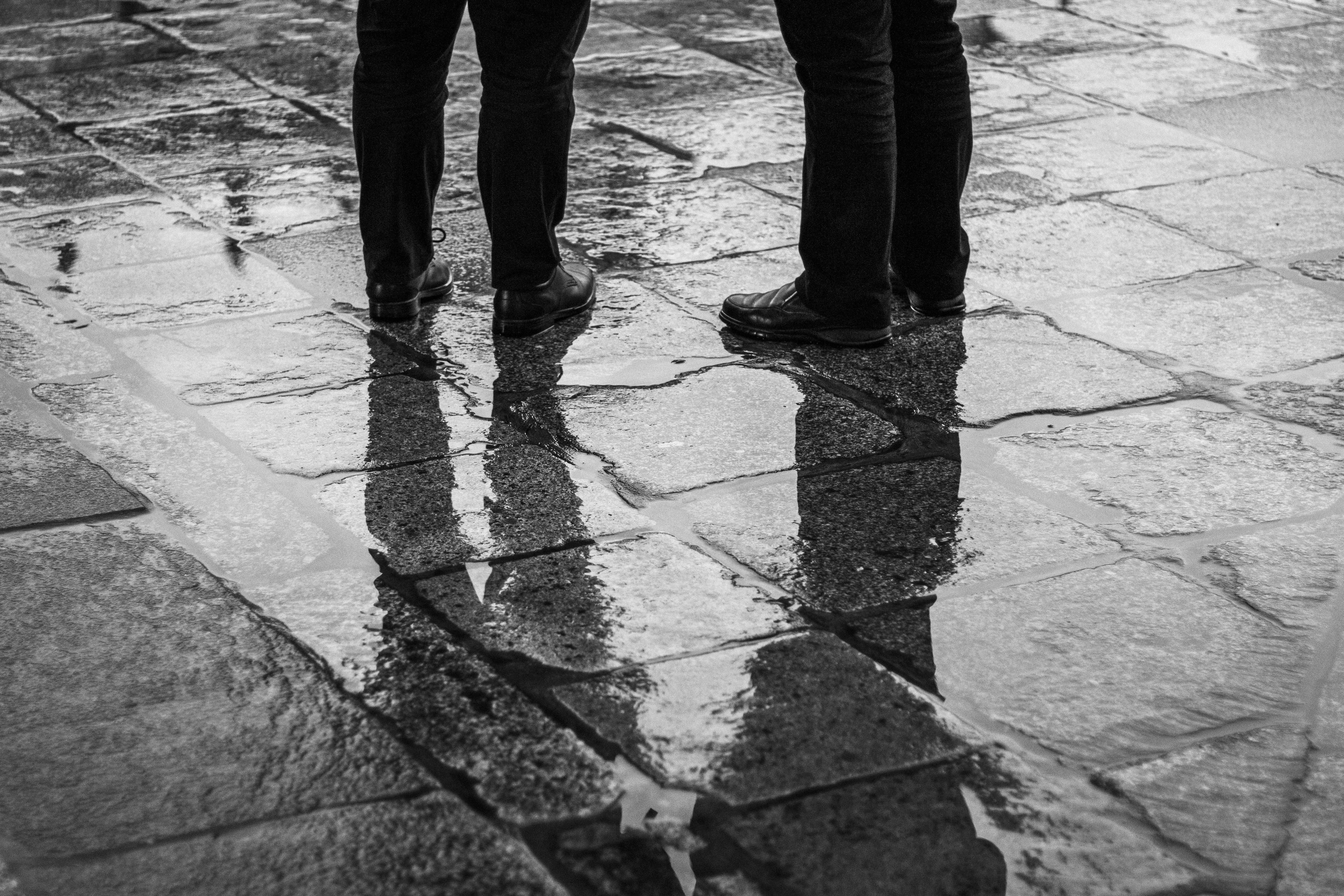 Two people standing in the rain with umbrellas photo – Free Salamanca ...