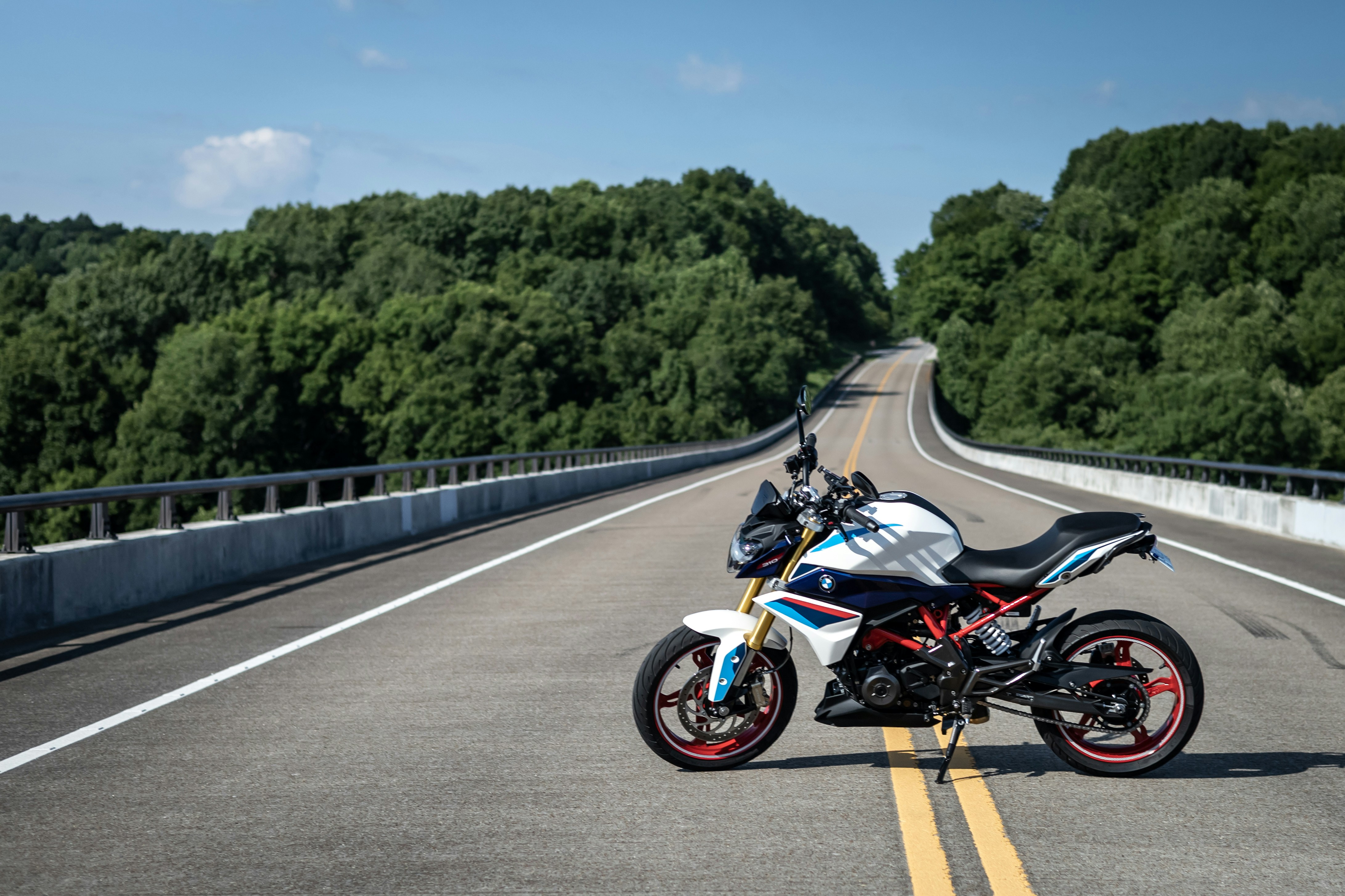 At the end of my ownership of the BMW G 310 R: custom livery, custom stainless/carbon through the swing arm bottom exit exhaust, tail tidy, sequential indicators and lightweight lithium battery. Photographed on Natchez Trace Parkway Bridge before they put the heinous and arguable fencing along the edges.