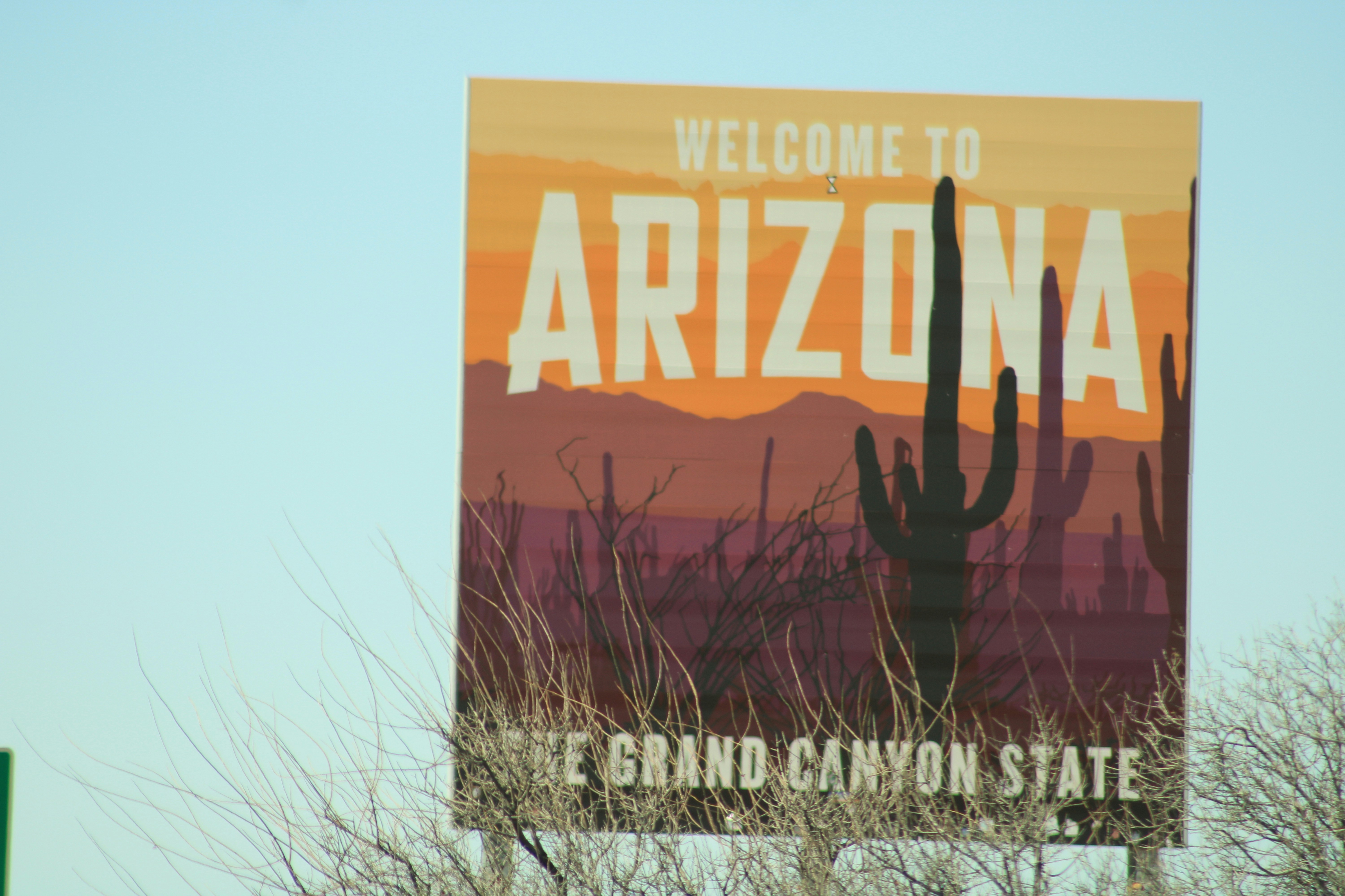 A welcome to arizona sign with a cactus in the background photo – Free ...