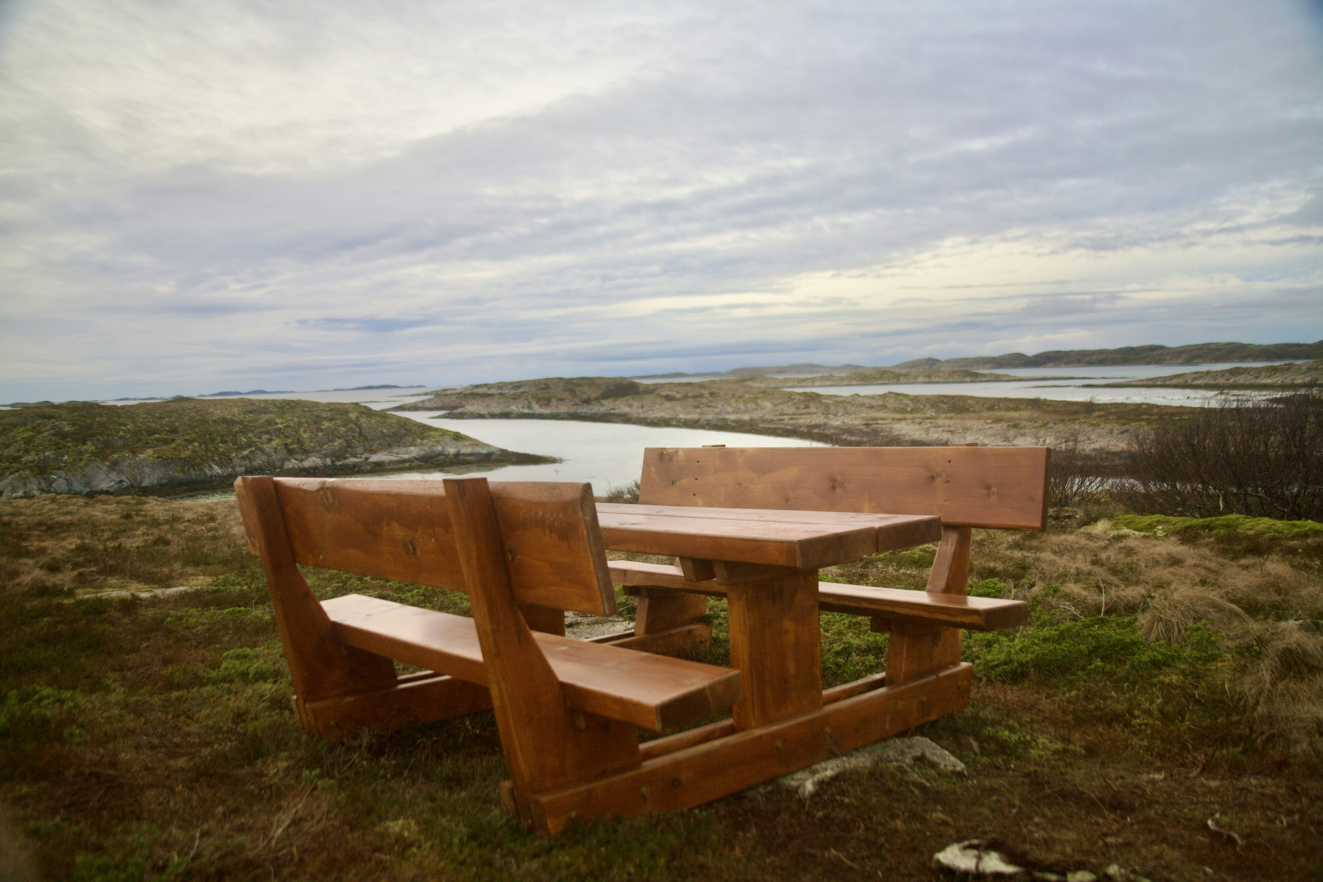 Orange bench located on top of a mountain