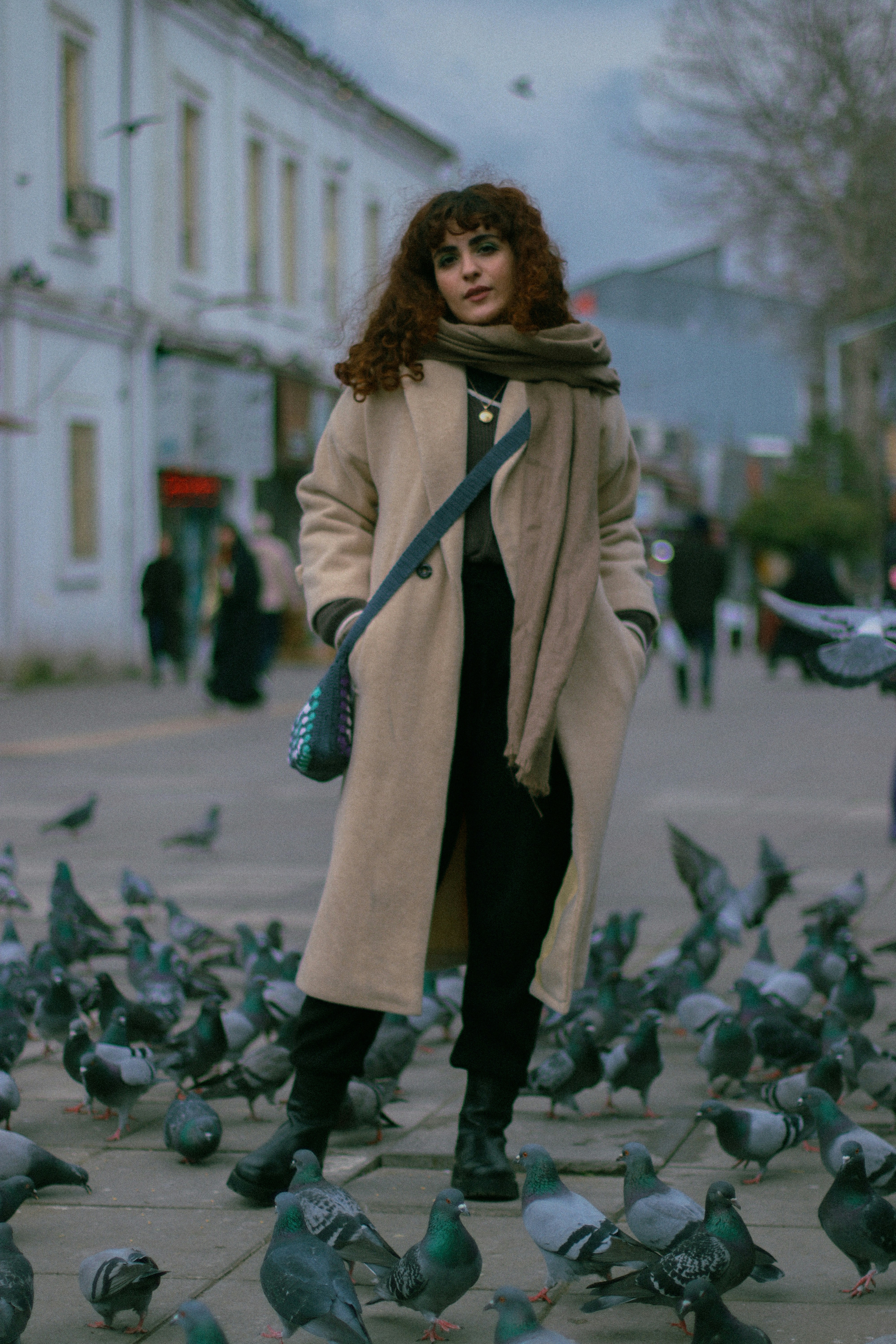 Coat and Pigeons: A Street Portrait in Soft Evening Light
