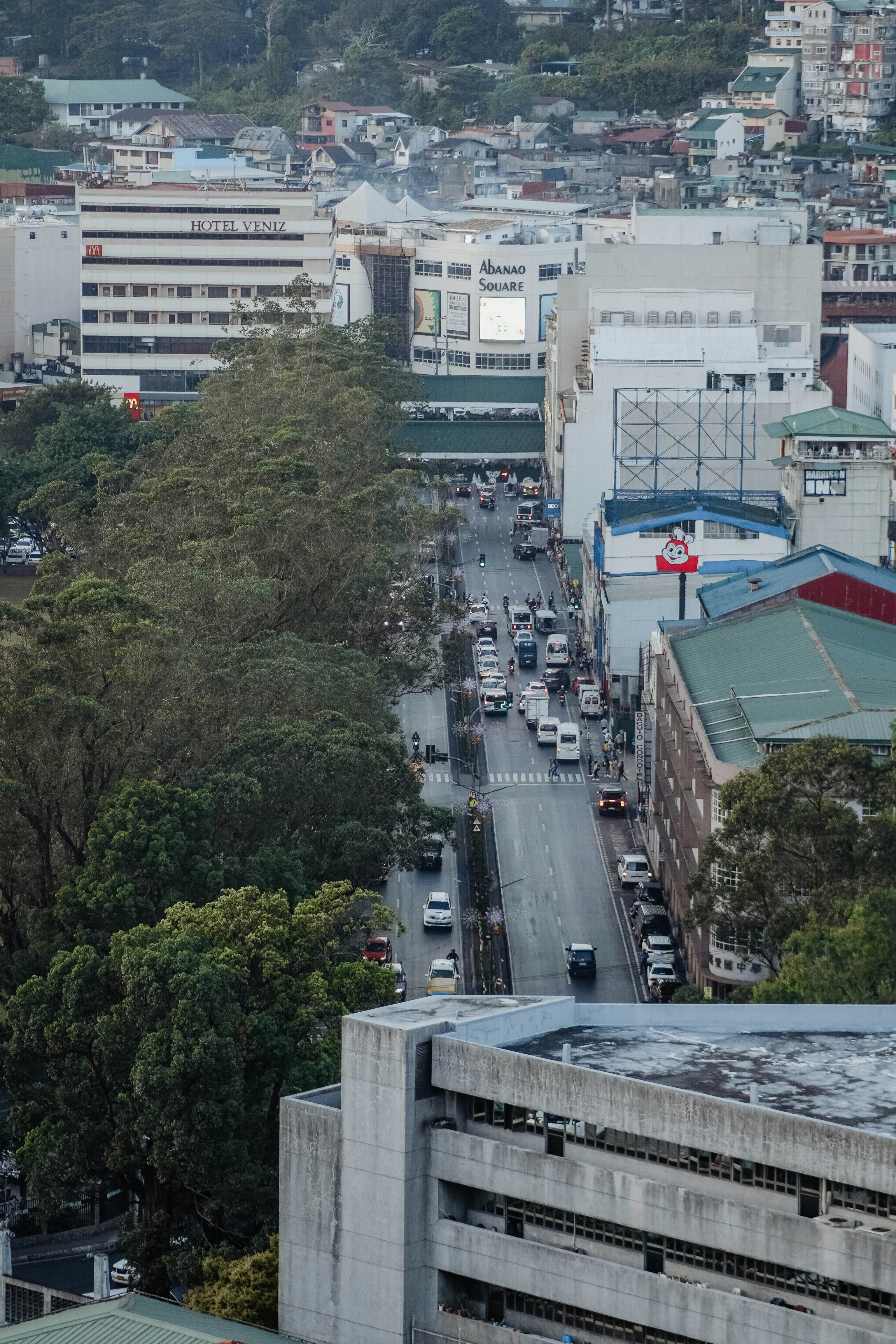 Pedestrians weaving in and out of the busy traffic.
