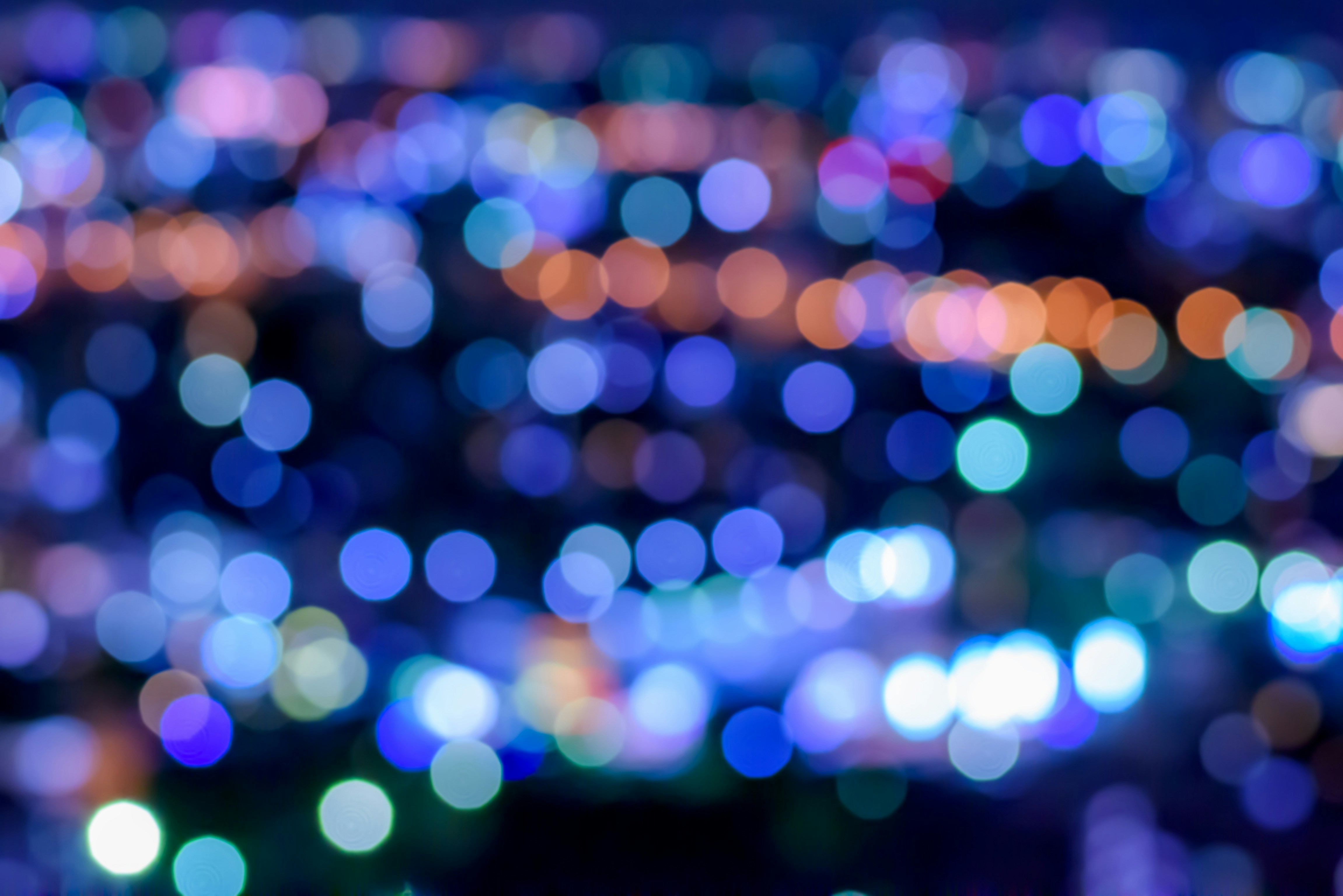 Neon Orbits: Soft Focus City Lights in a Nightscape
