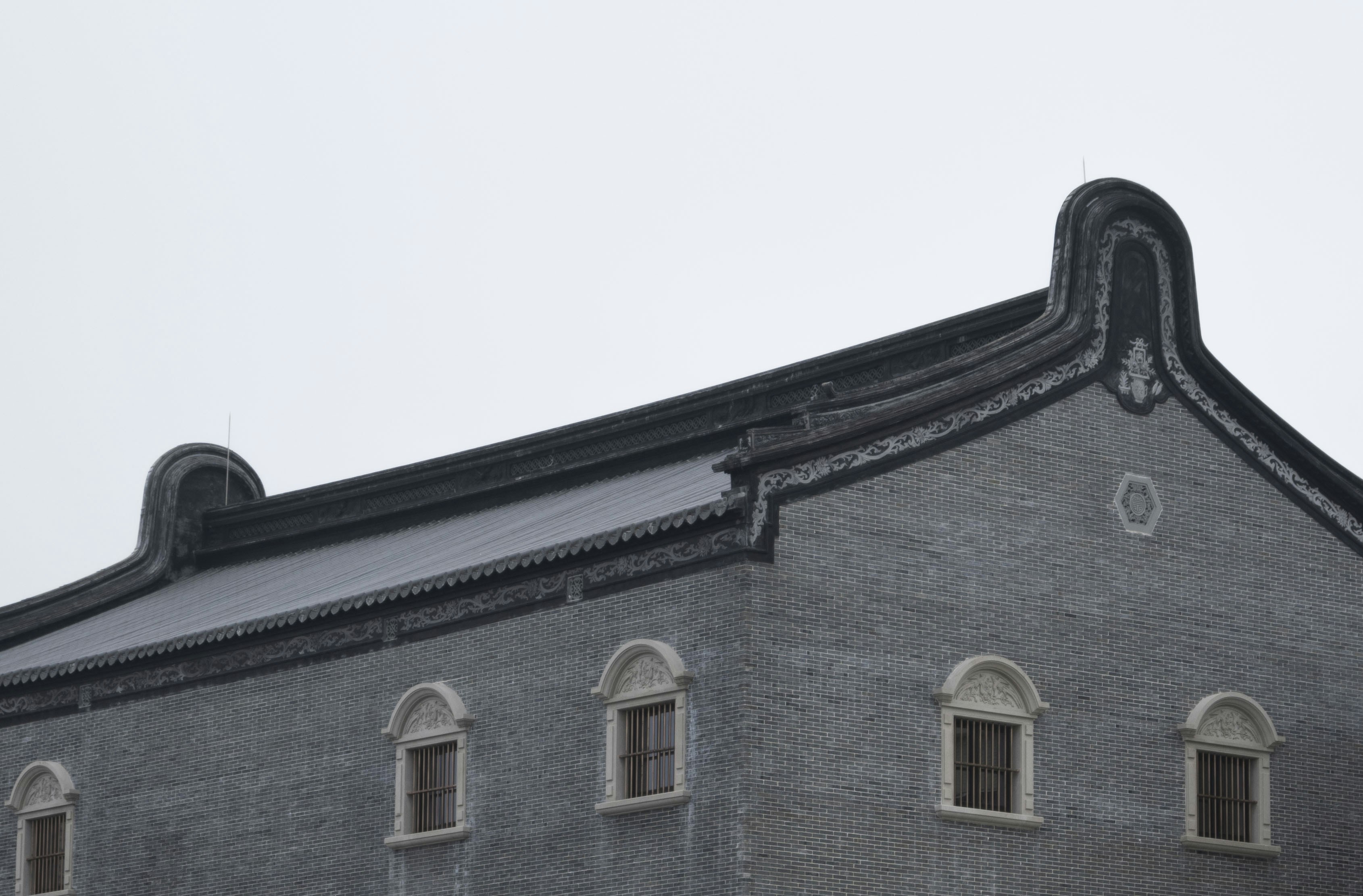 an old building with a clock on the top of it