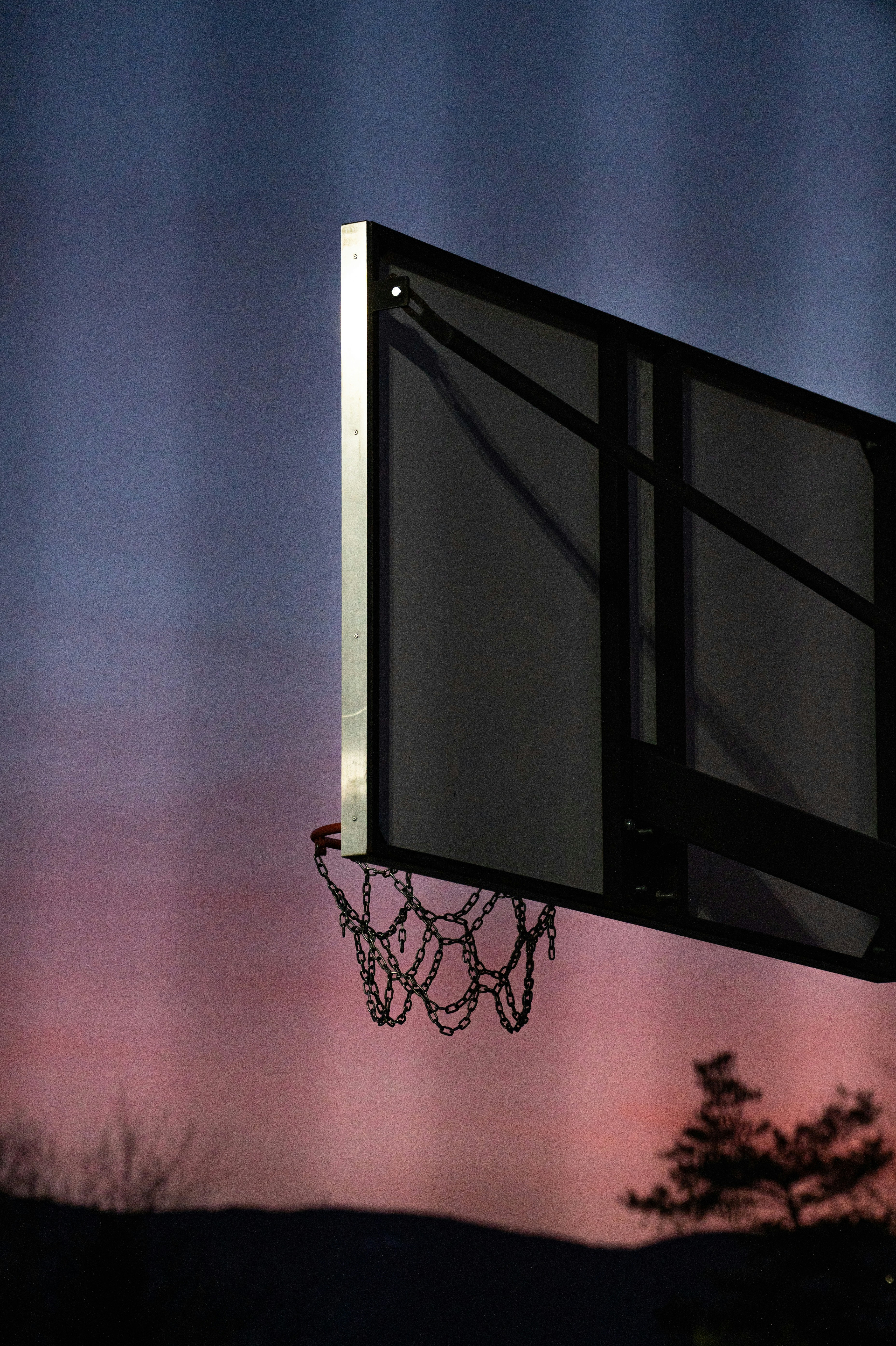 a basketball hoop with a chain hanging from it