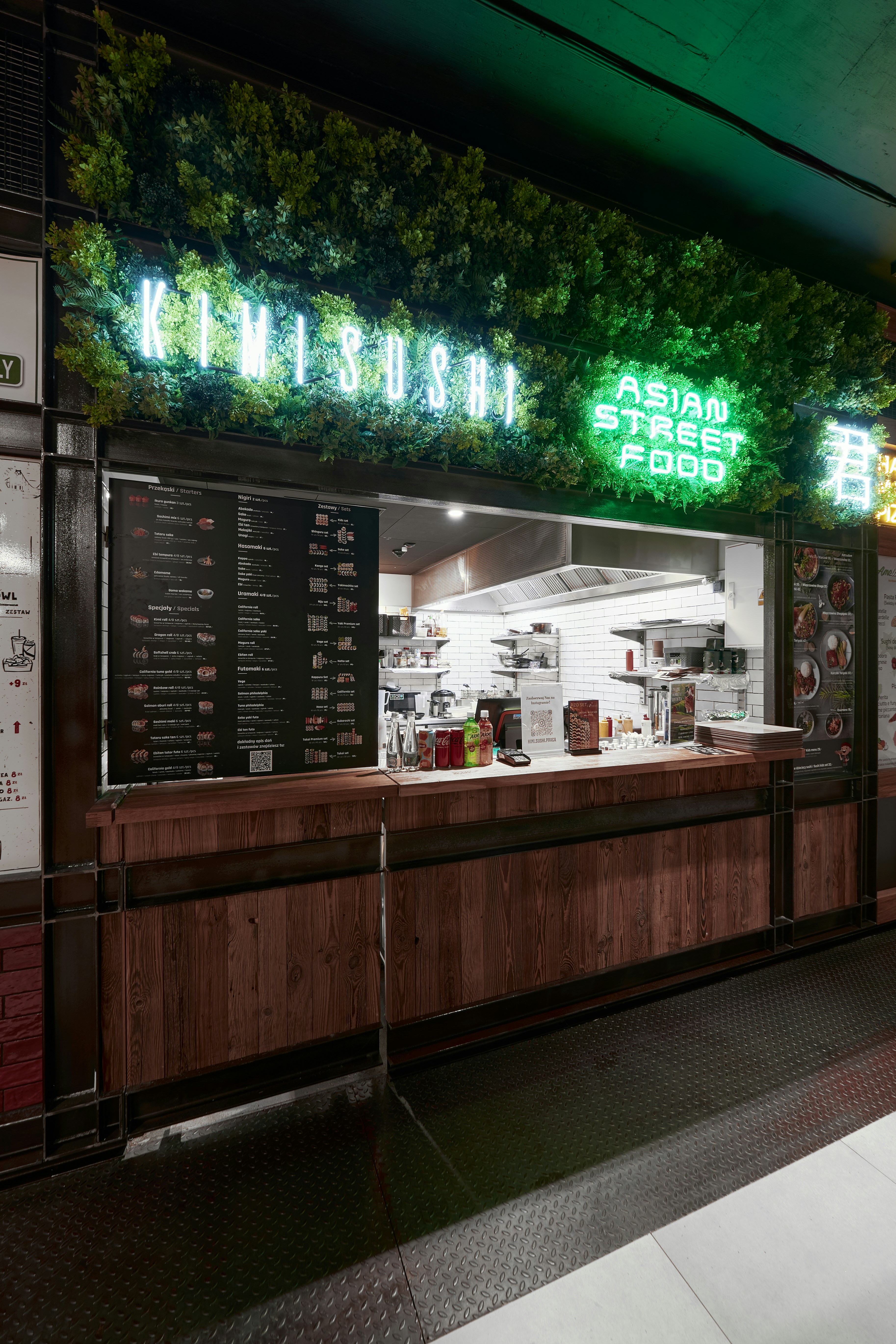 Neon Green Signage Crowns a Wood-Faced Asian Street Food Stall at Night