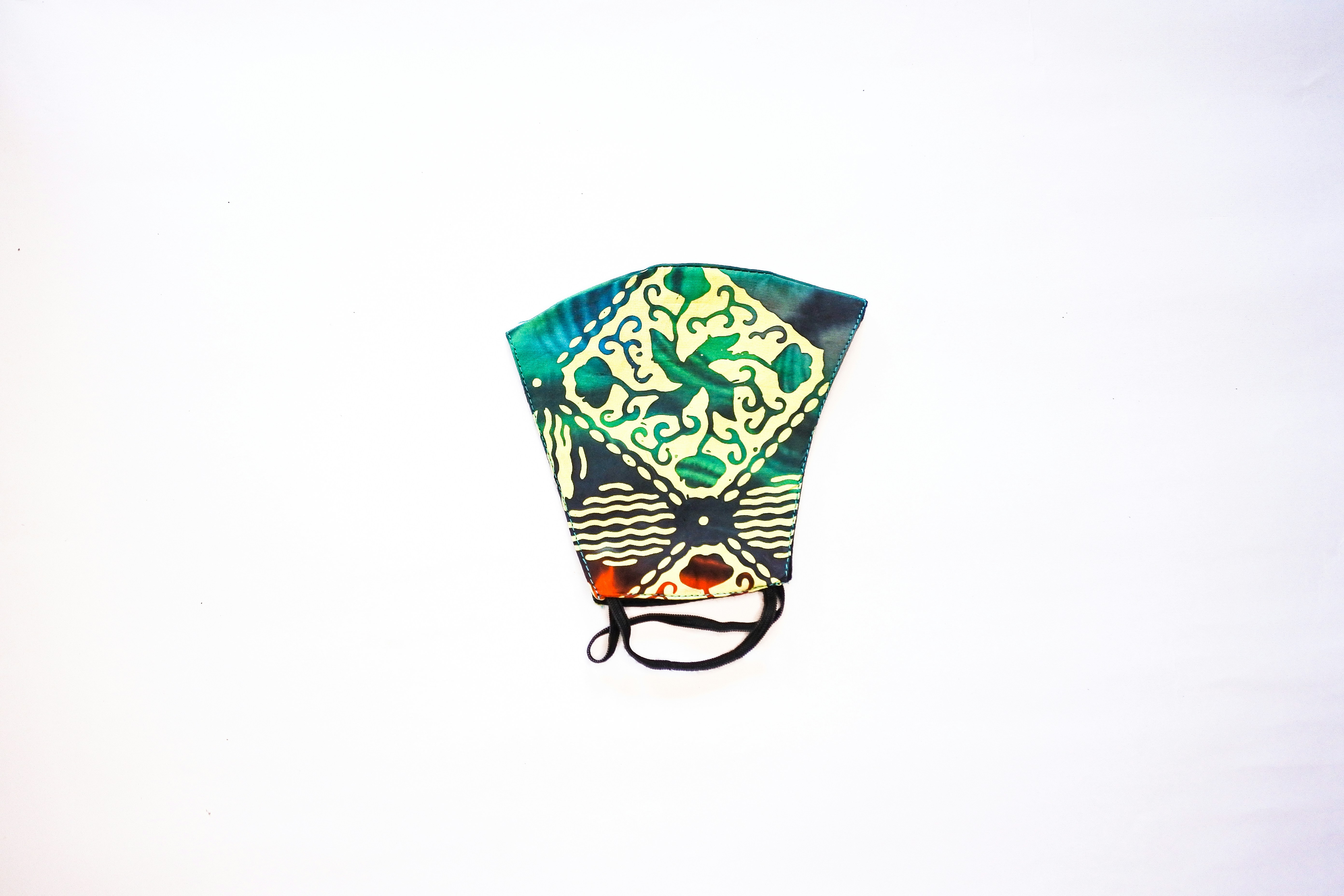 Turquoise Motif Mask Staged Against a Pure White Backdrop