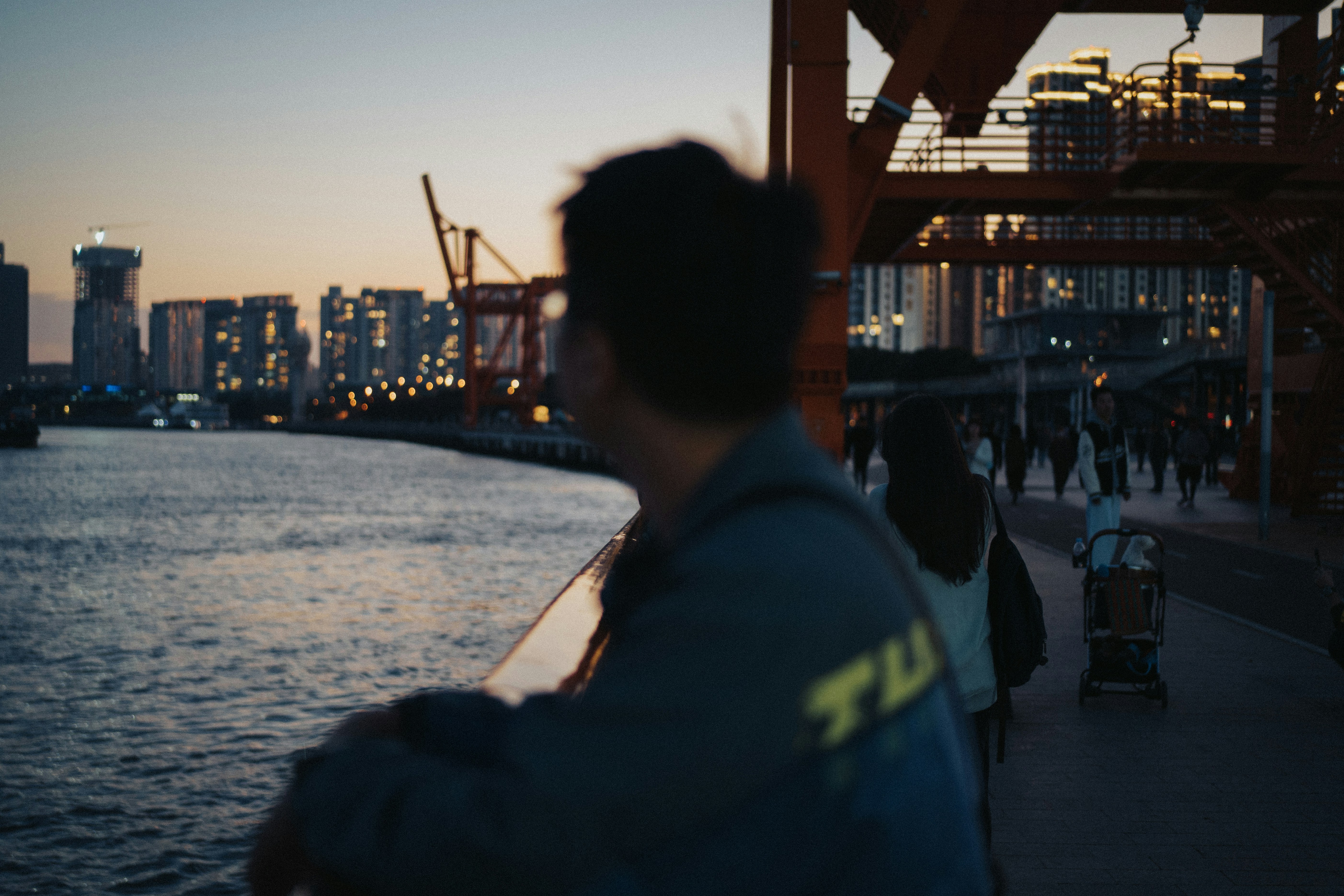 Hazy Riverside Walk: A Blurred Portrait by the Pier