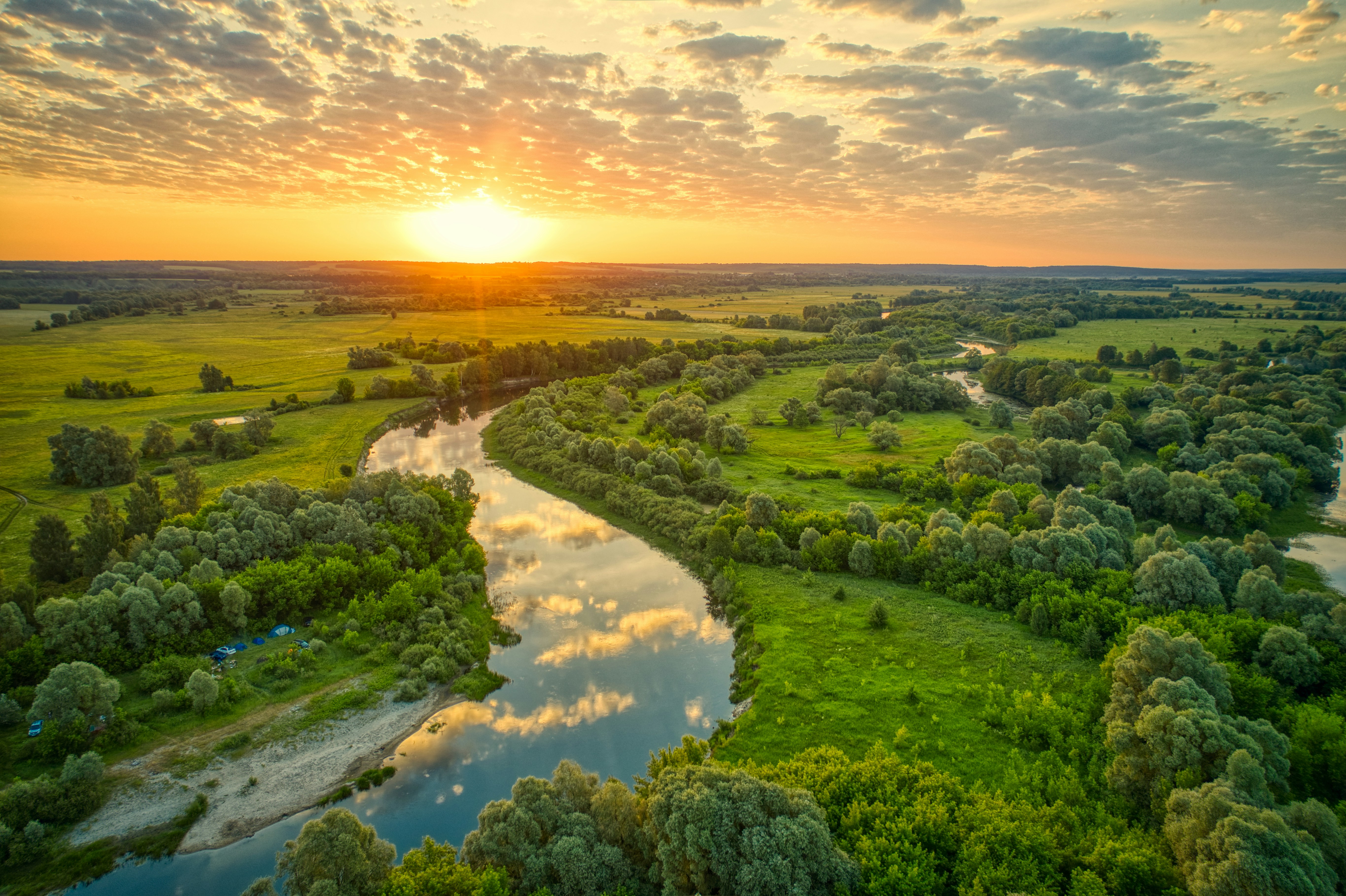 A river running through a lush green countryside photo – Free Land ...