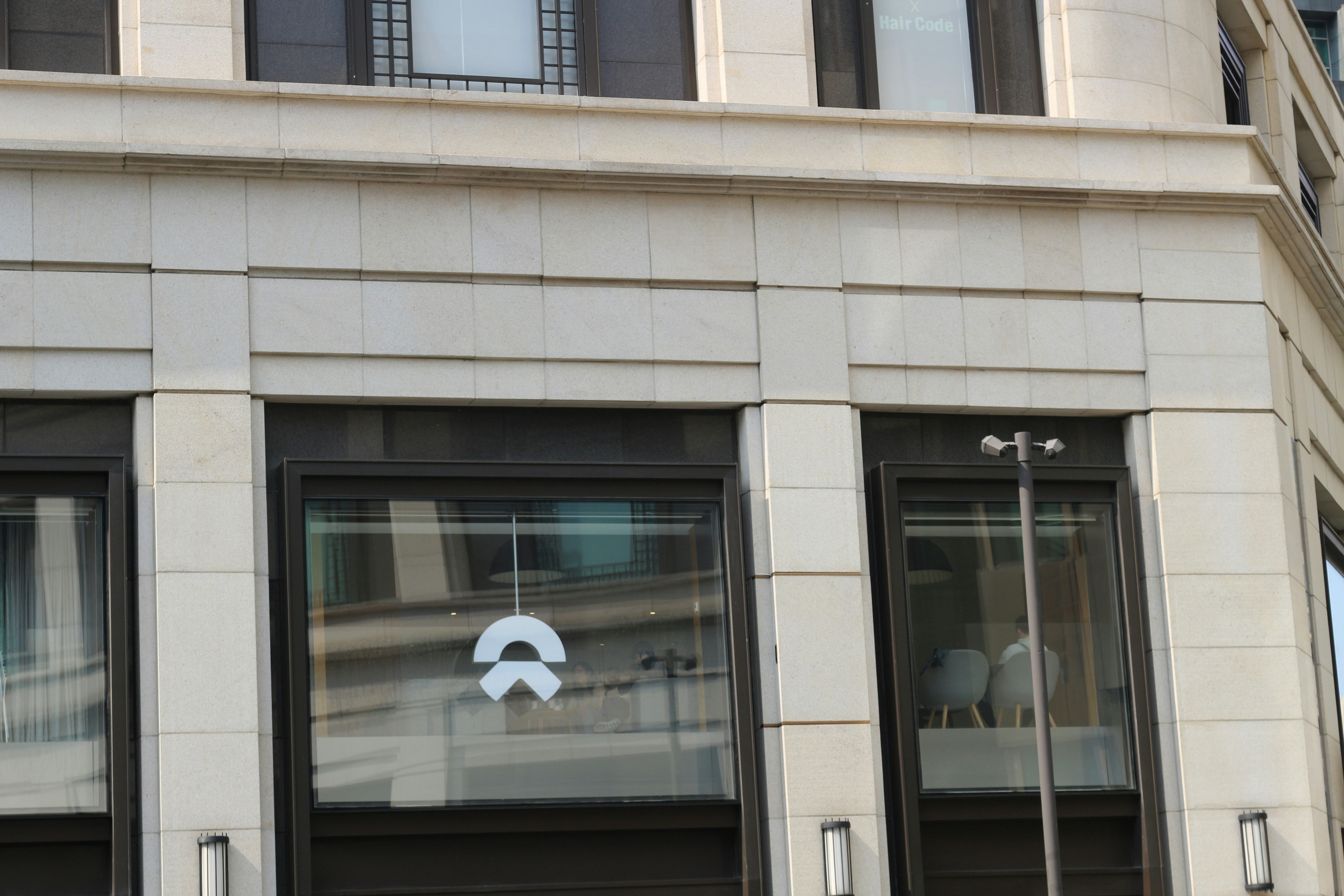 Circular Emblem in a Modern City Facade Window