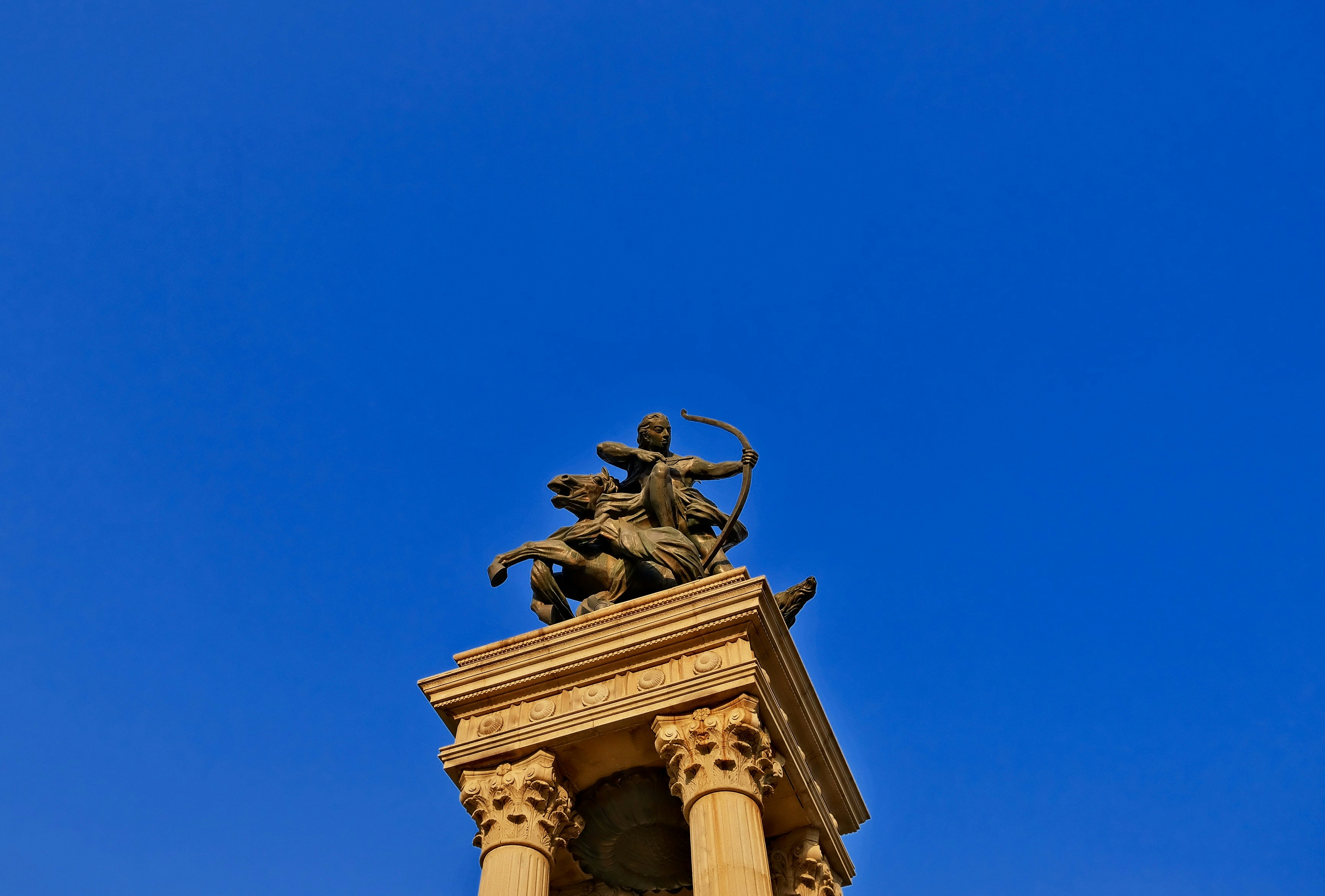 Archer's Triumph Against Azure Skies
