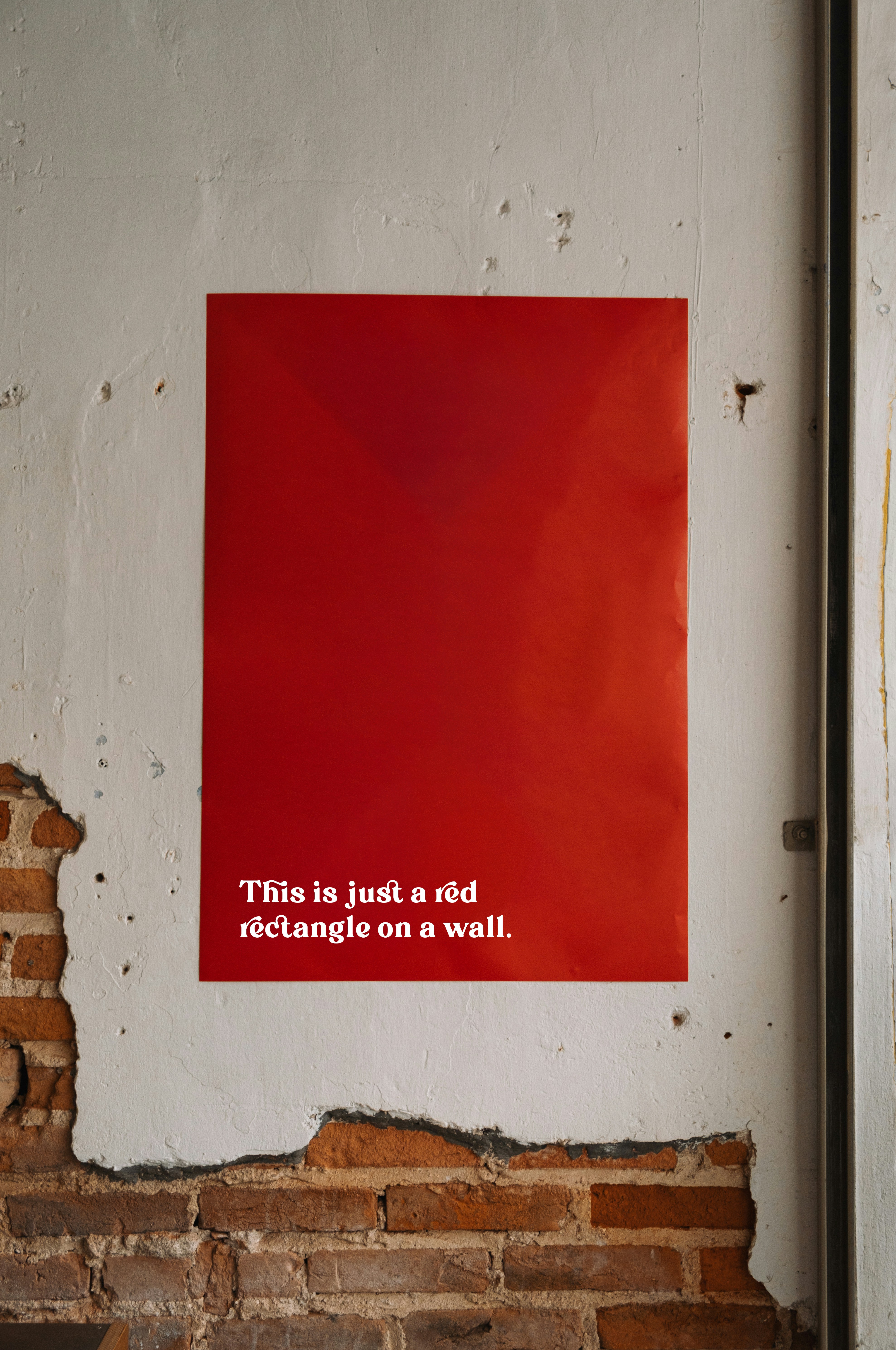 Red Rectangle on a Wall: Minimalist Poster with White Text