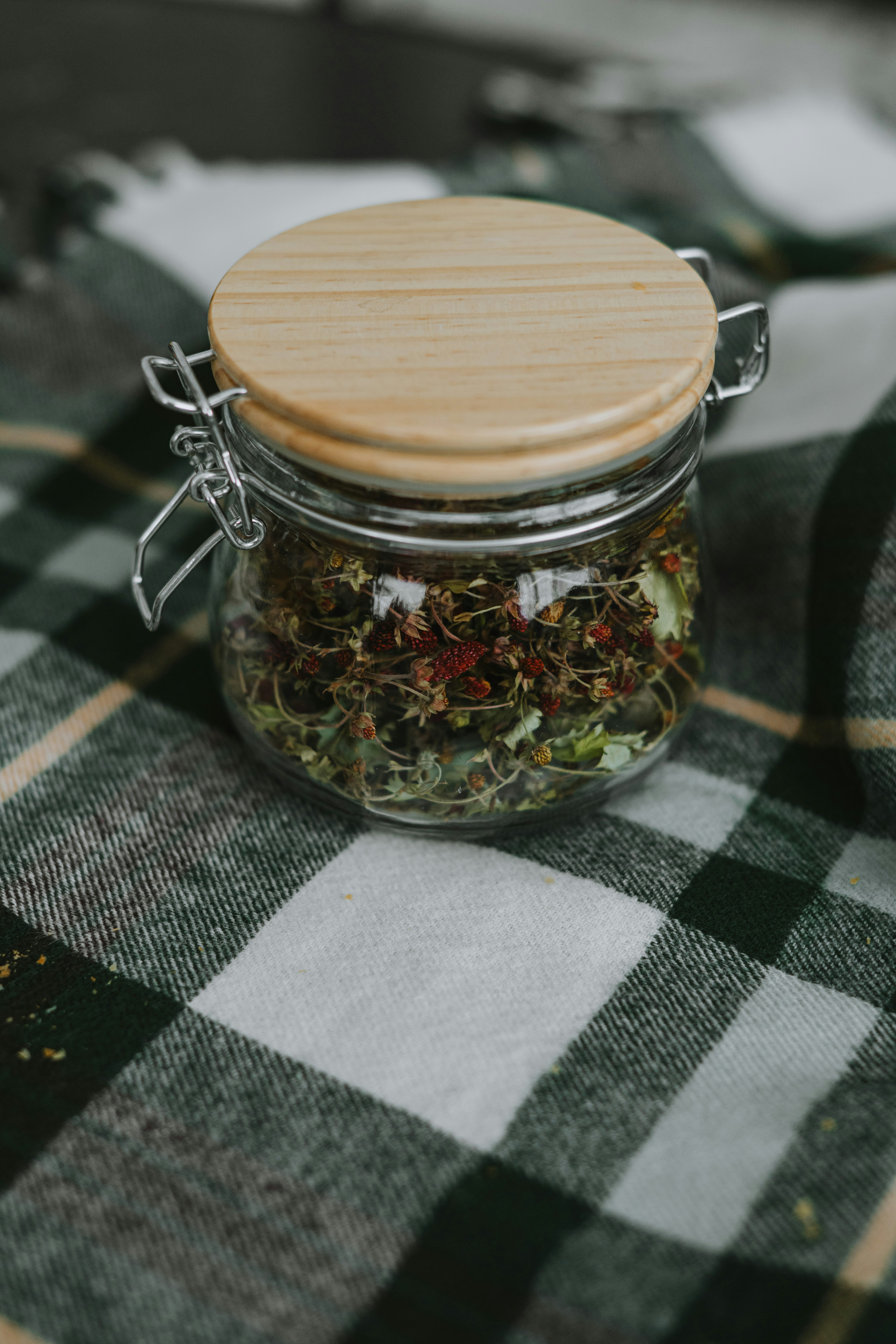 Pocket Apothecary: Dried Herbs in a Glass Jar on Plaid