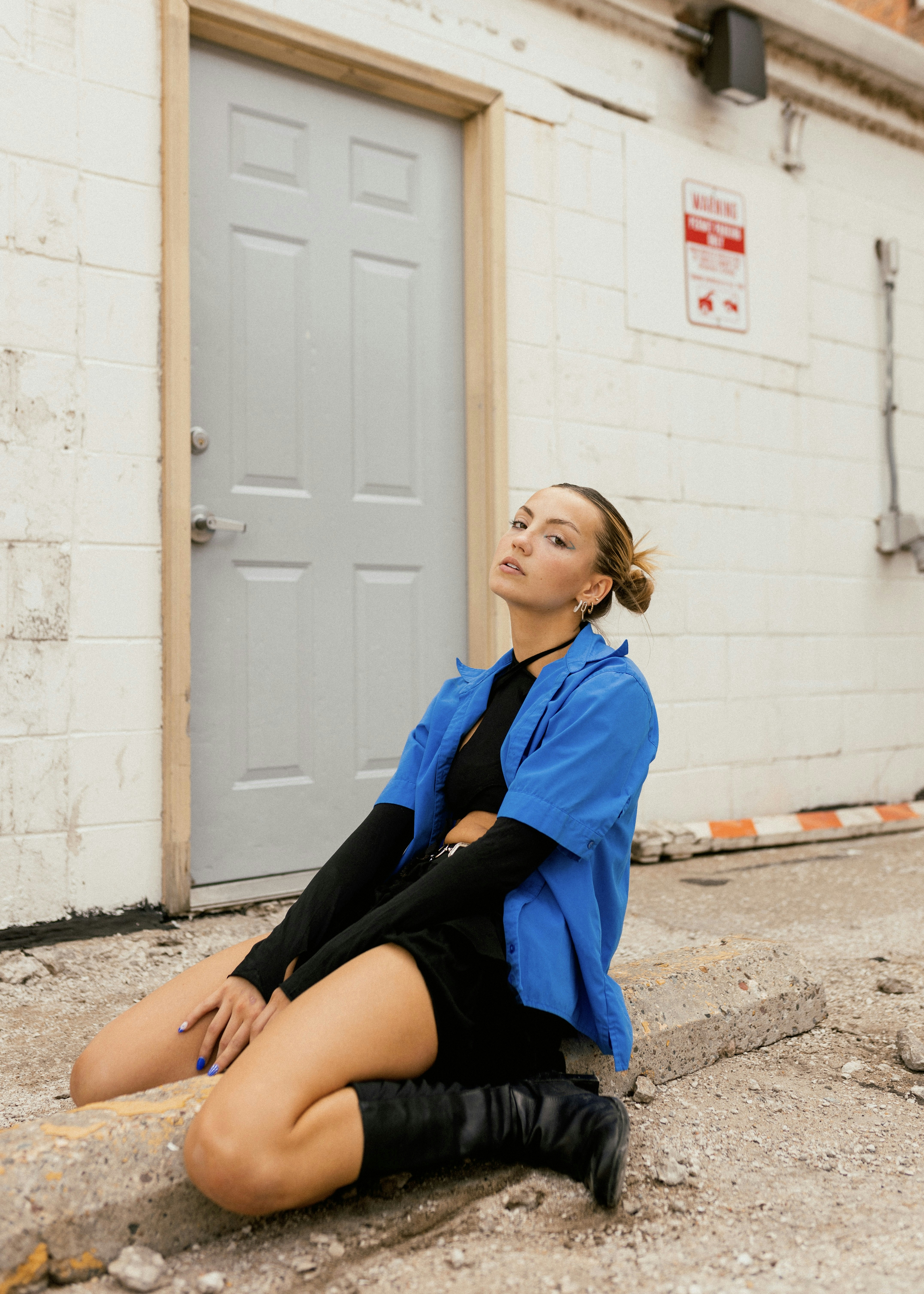 Blue-Accent Street Pose by a Weathered Doorway