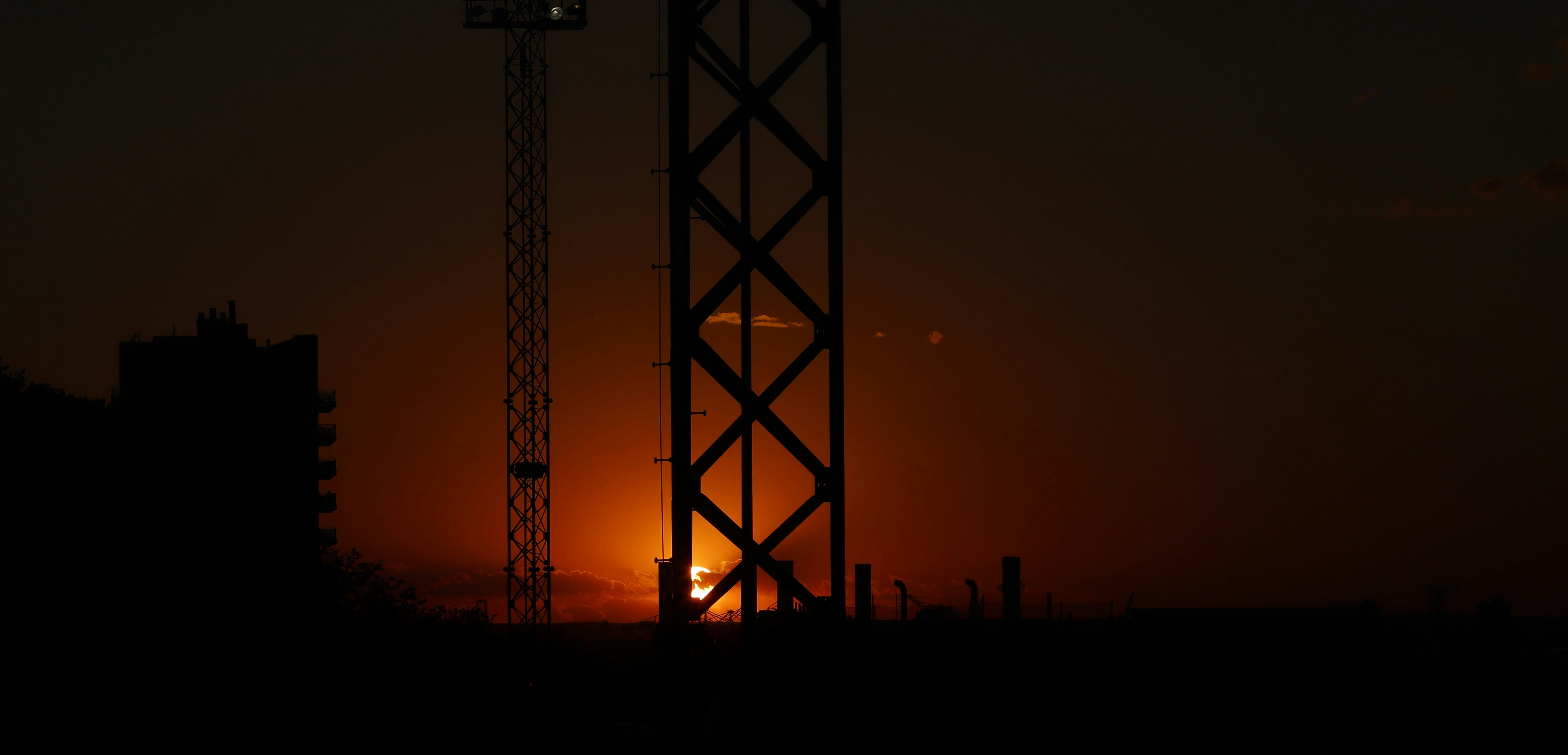 Dusk Ember at the Tower: A Quiet Silhouette Against a Fiery Horizon