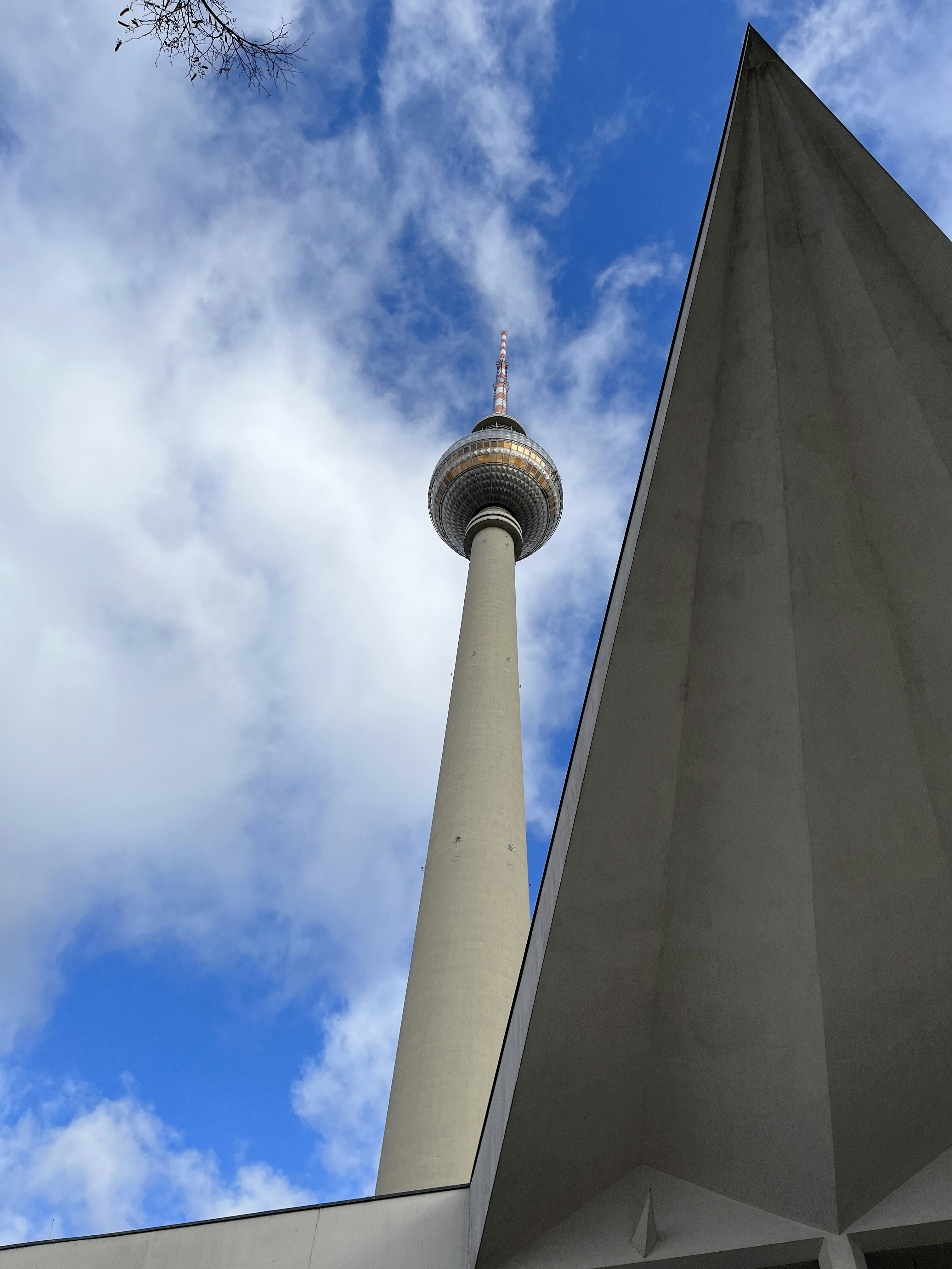 Vertical Beacon Above Concrete Geometry: Berlin's Fernsehturm in Focus