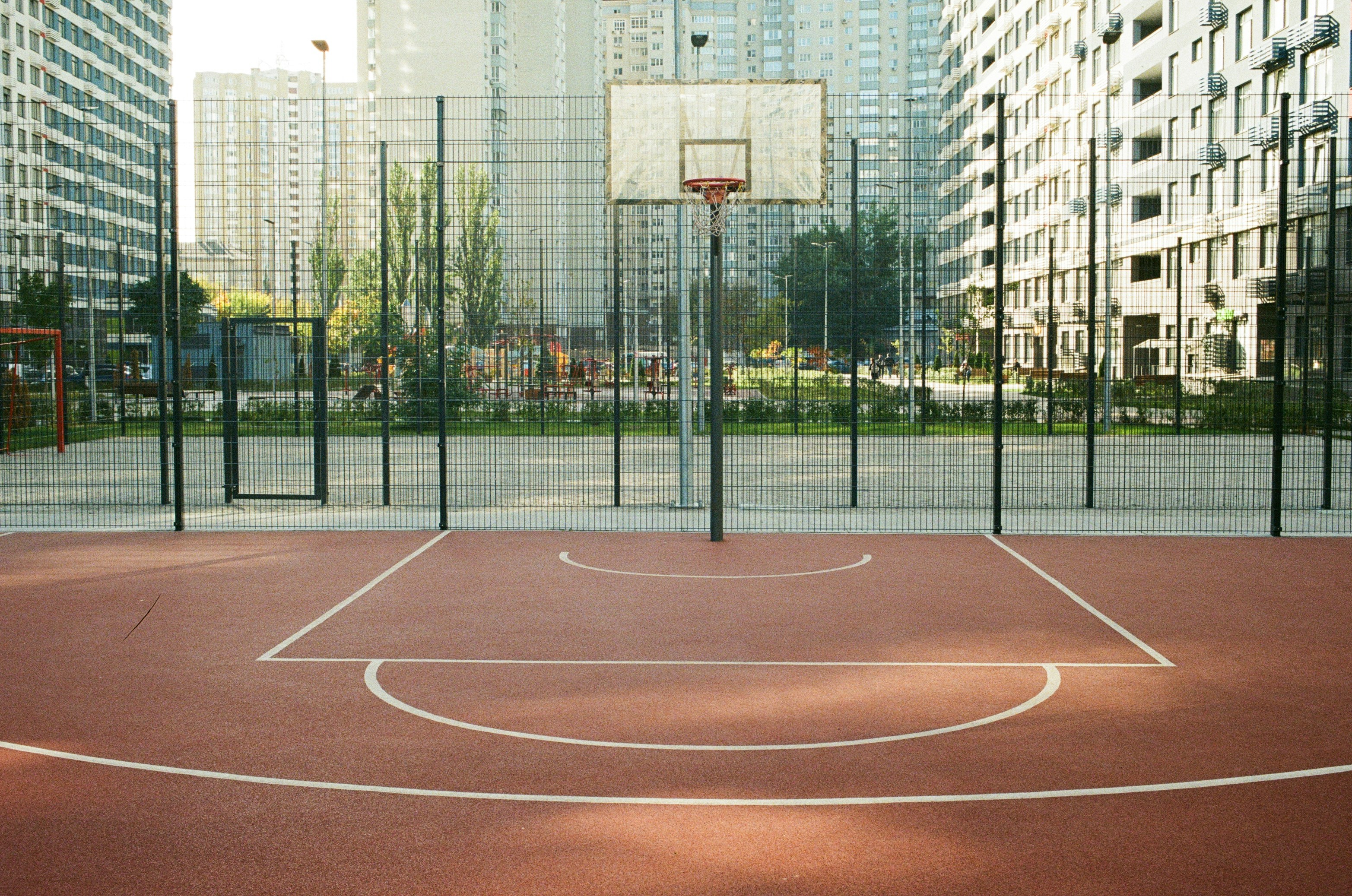 A basketball court with a basketball hoop in the middle of it photo ...