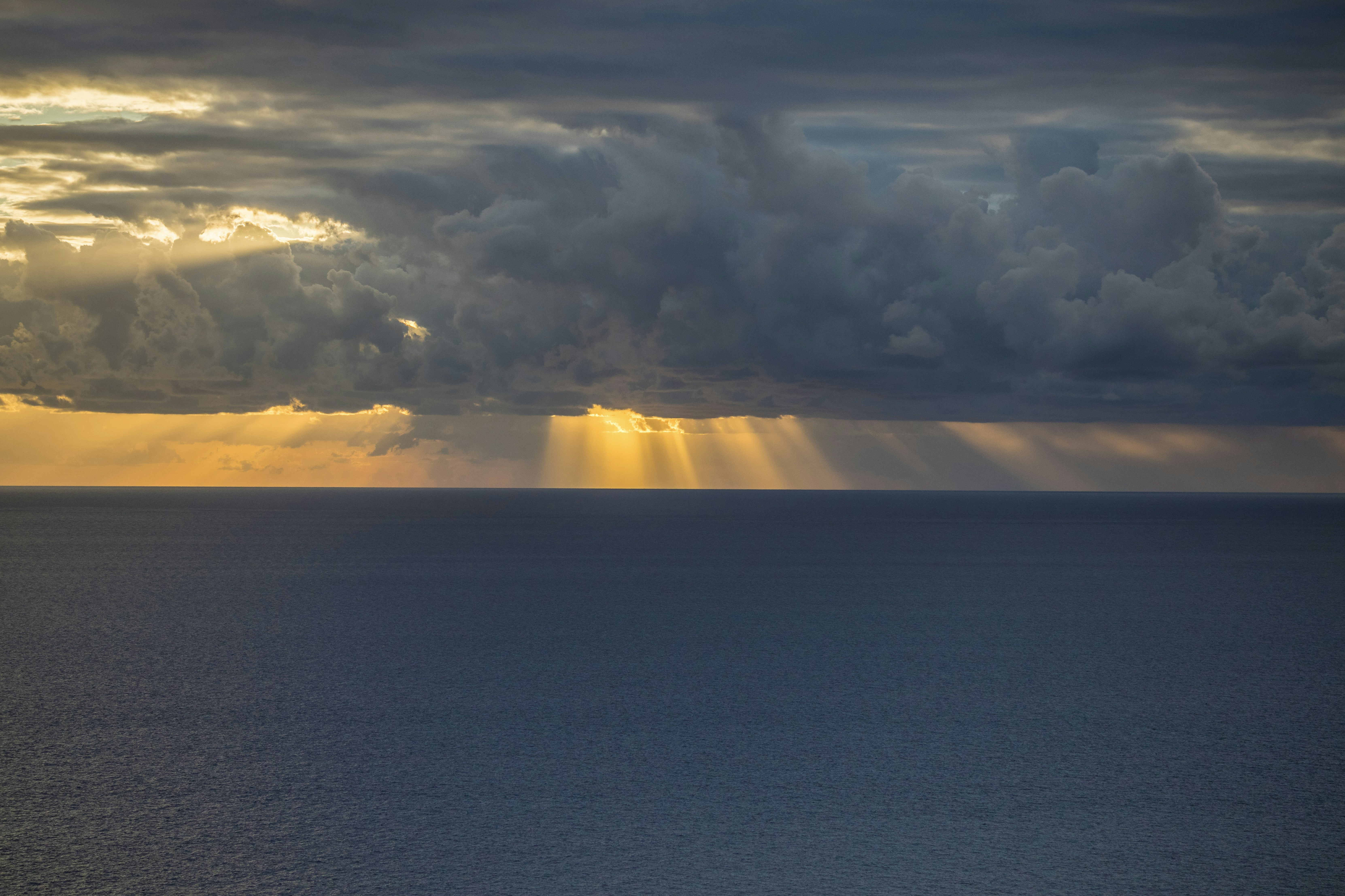 A large body of water under a cloudy sky photo – Free Gran canaria ...
