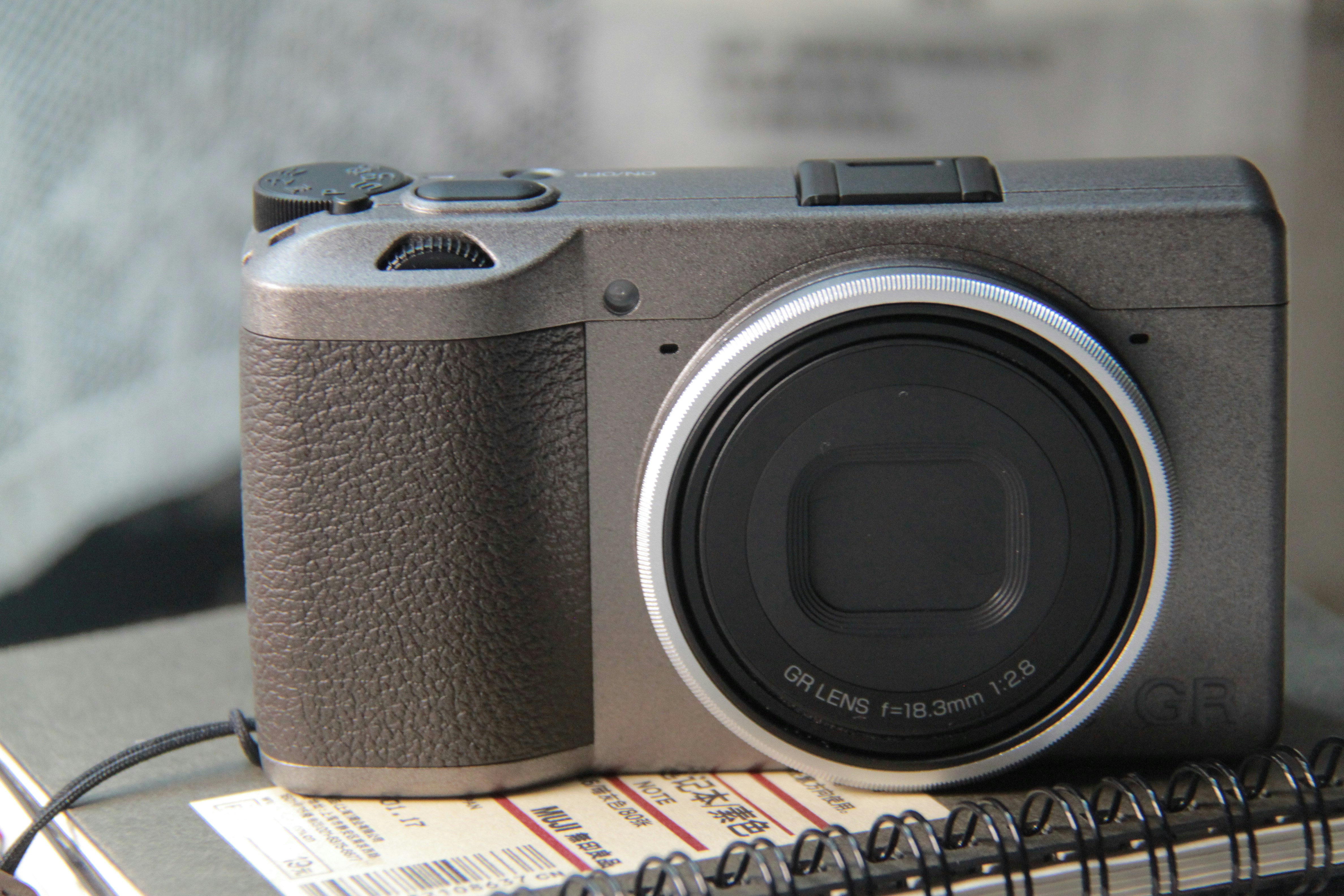 A camera sitting on top of a notebook photo – Free Camera Image on Unsplash