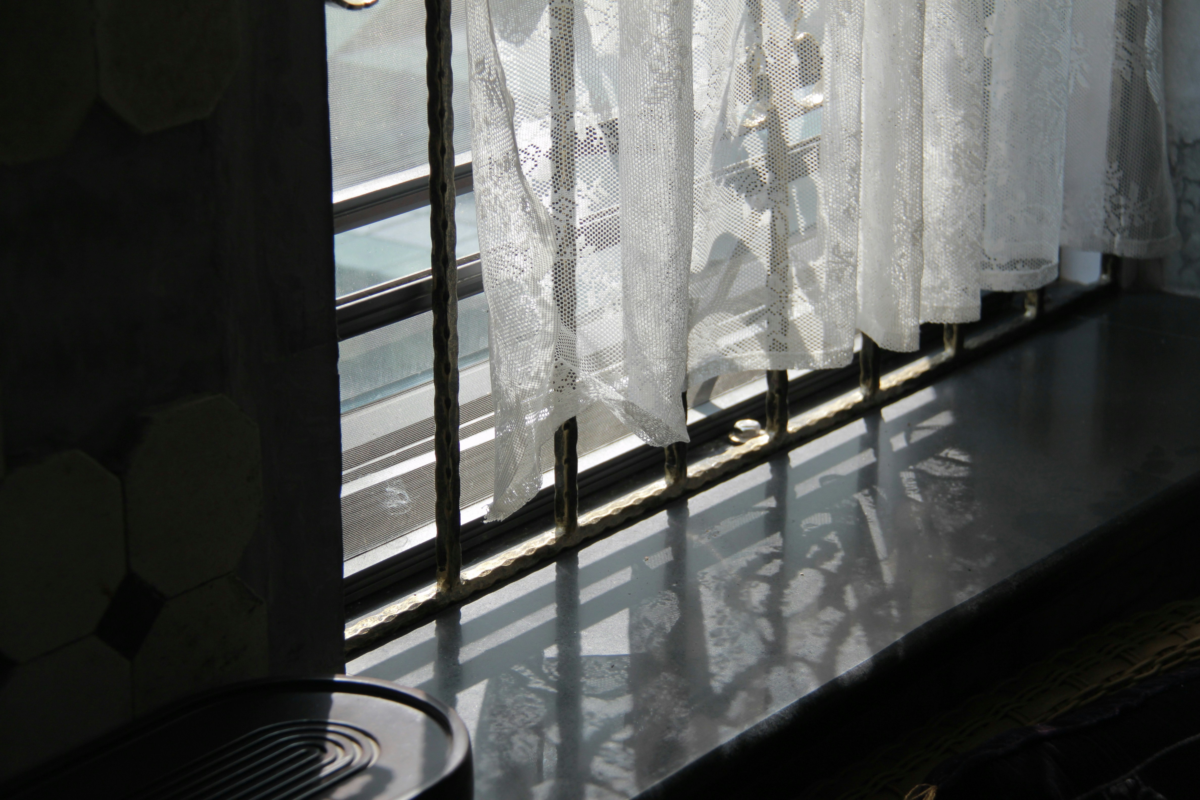A window with white curtains and a fan photo – Free Window Image on ...