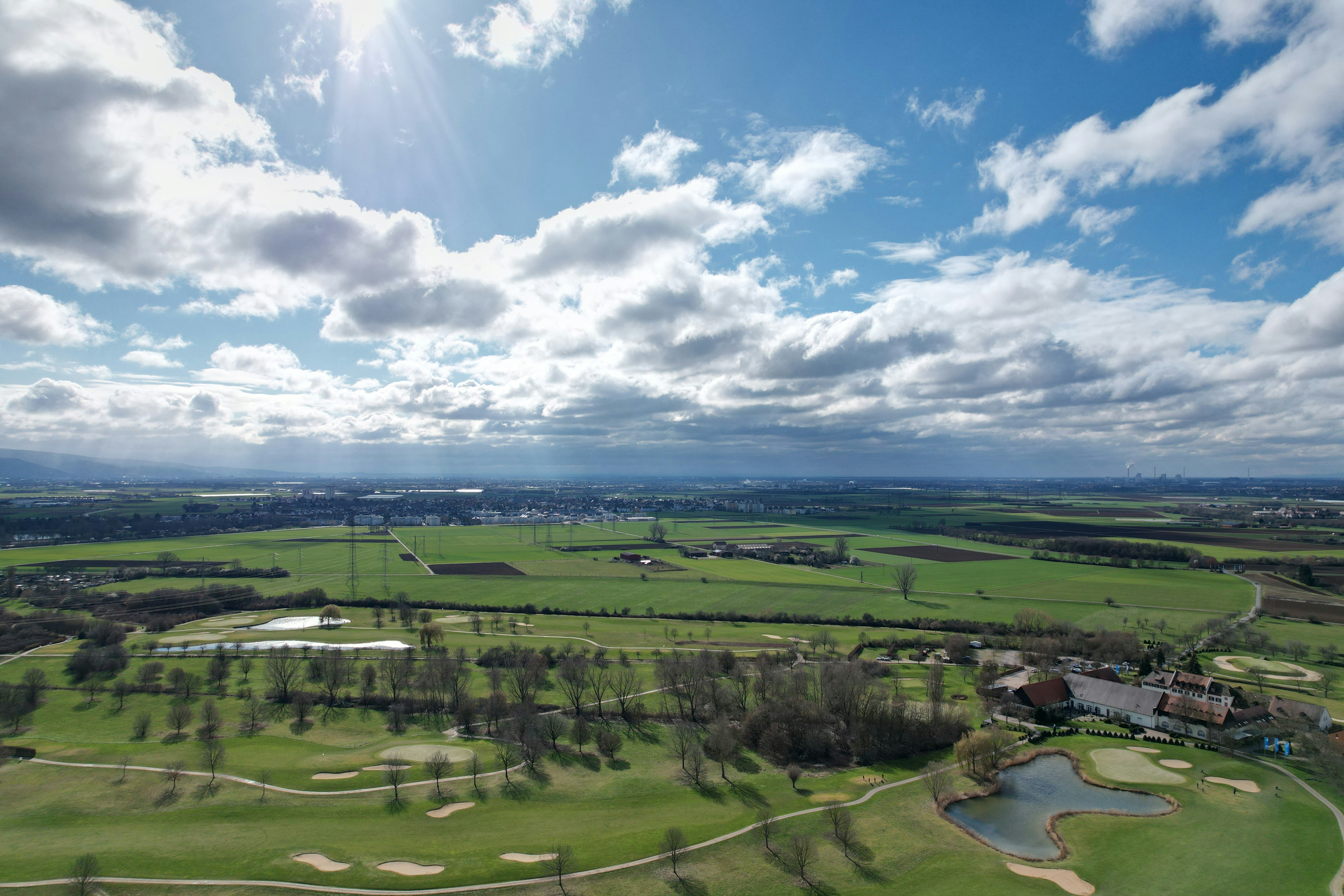 an aerial view of a green golf course