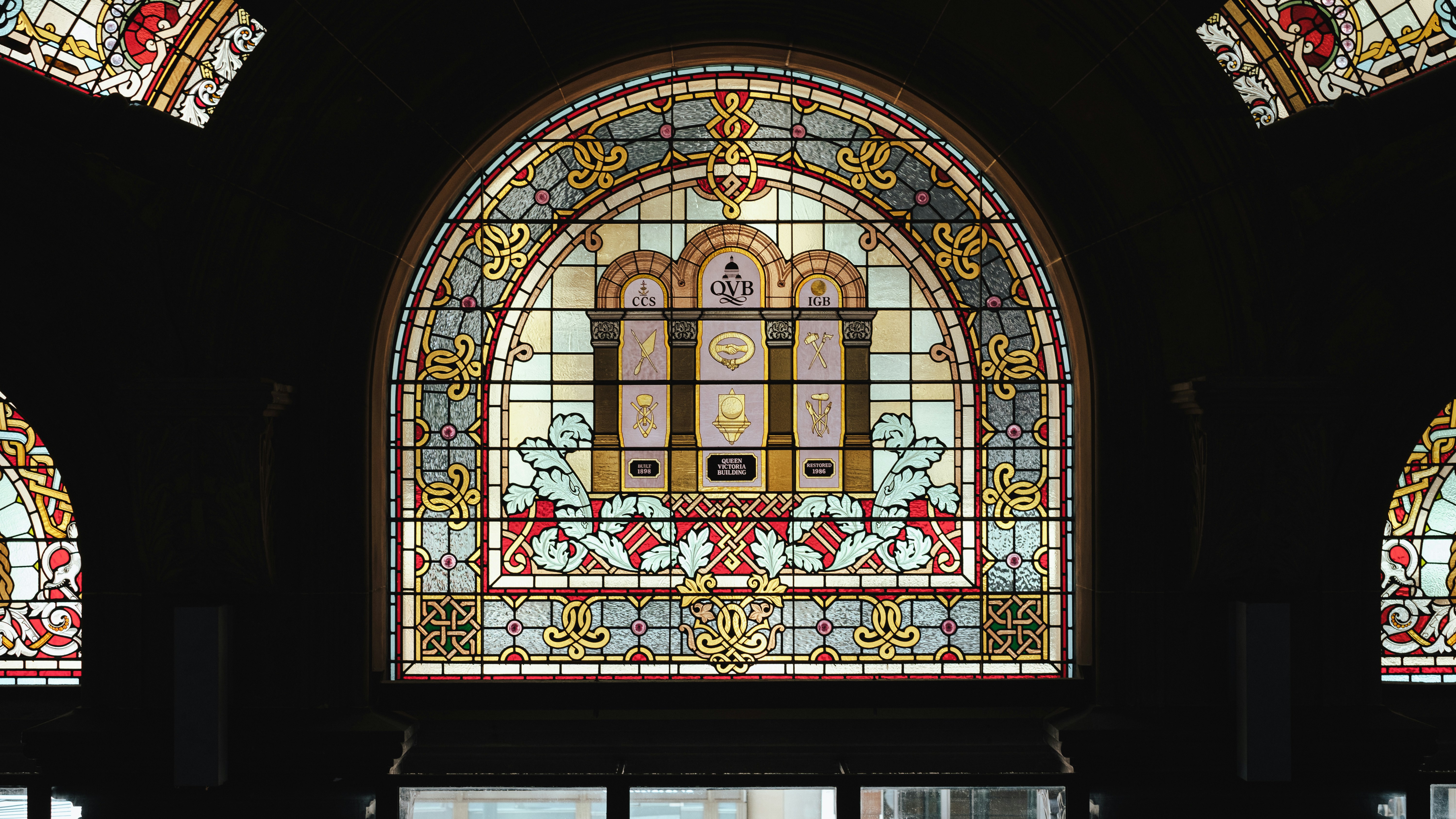 a large stained glass window in a building