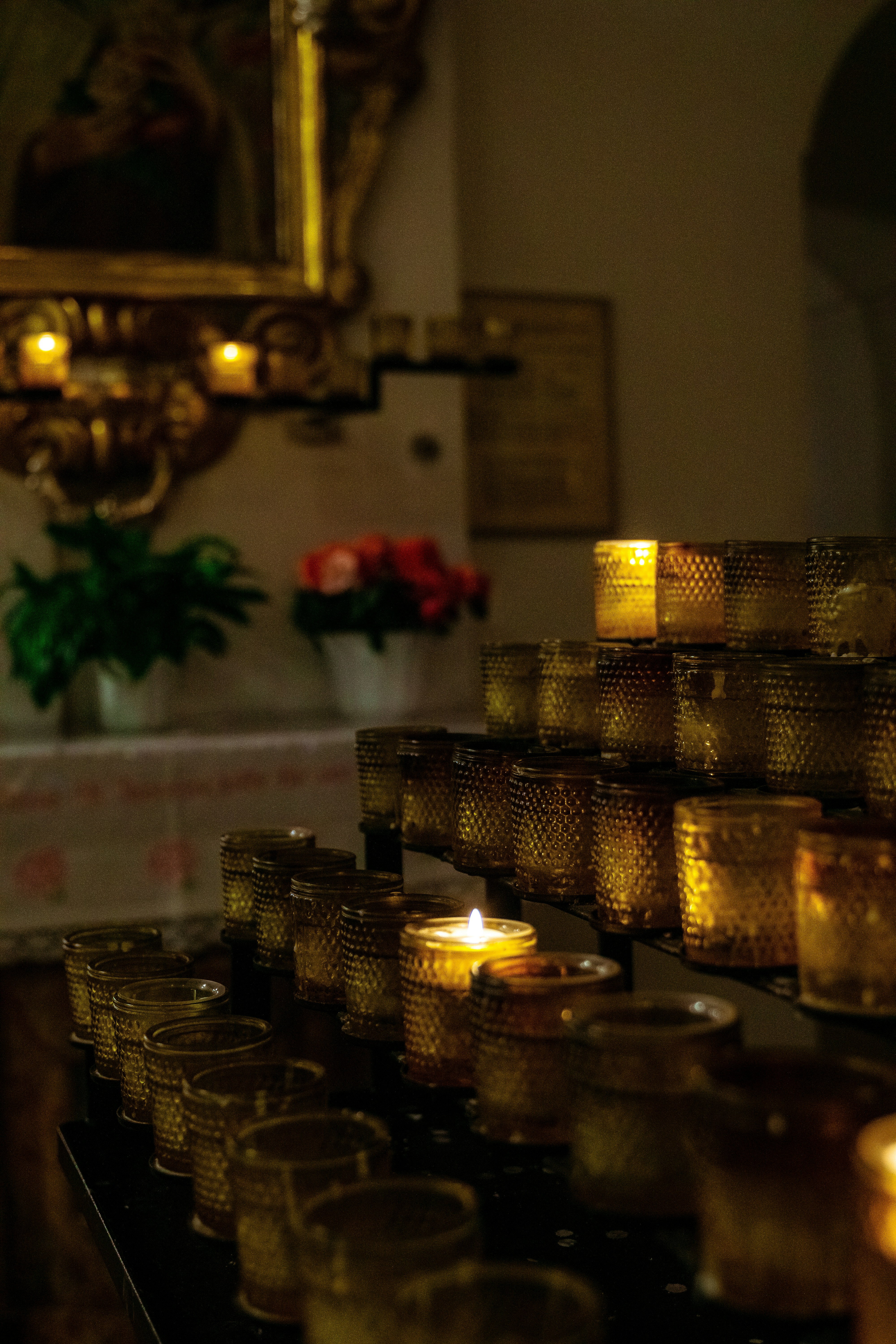 Candle Pyramid in a Dim Chapel: A Quiet Glow